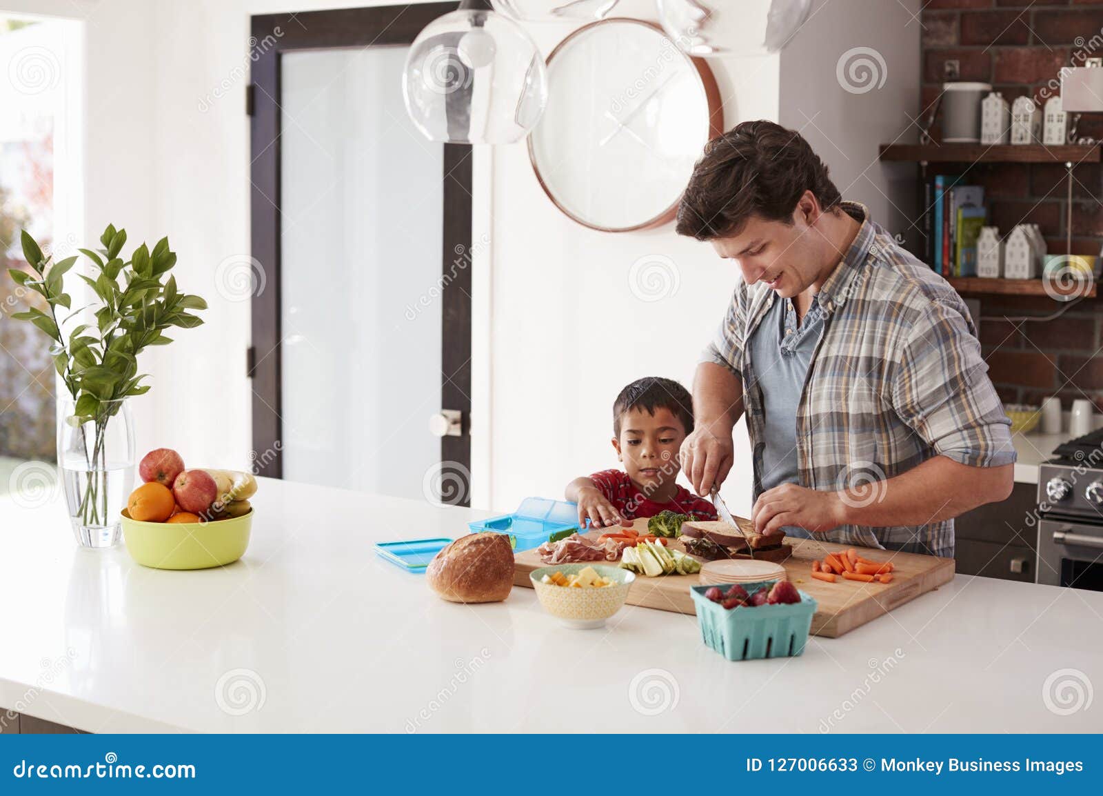 Father and Son Making School Lunch in Kitchen at Home Stock Image ...
