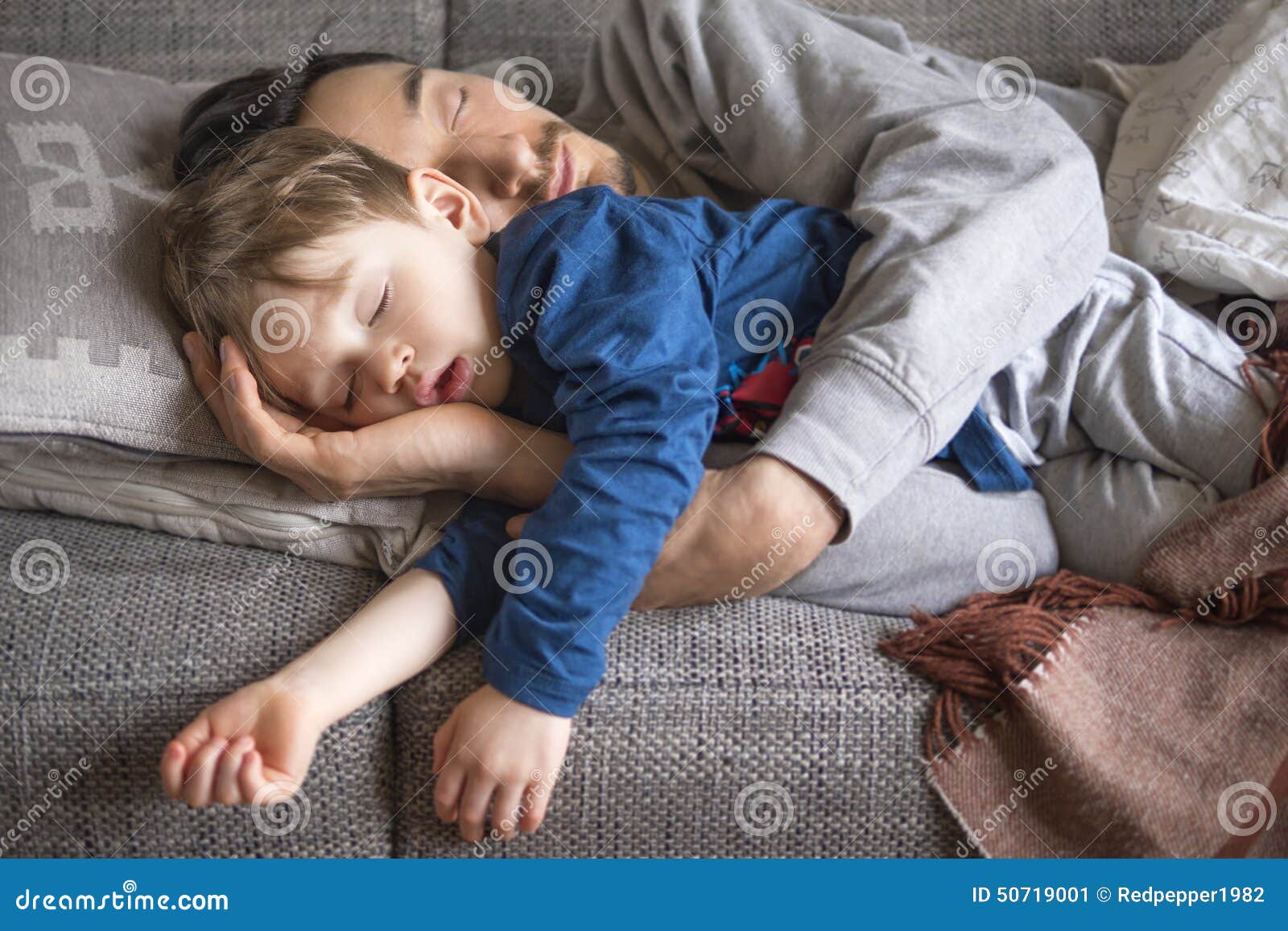 Father and Son Napping on the Couch Stock Image - Image of father ...