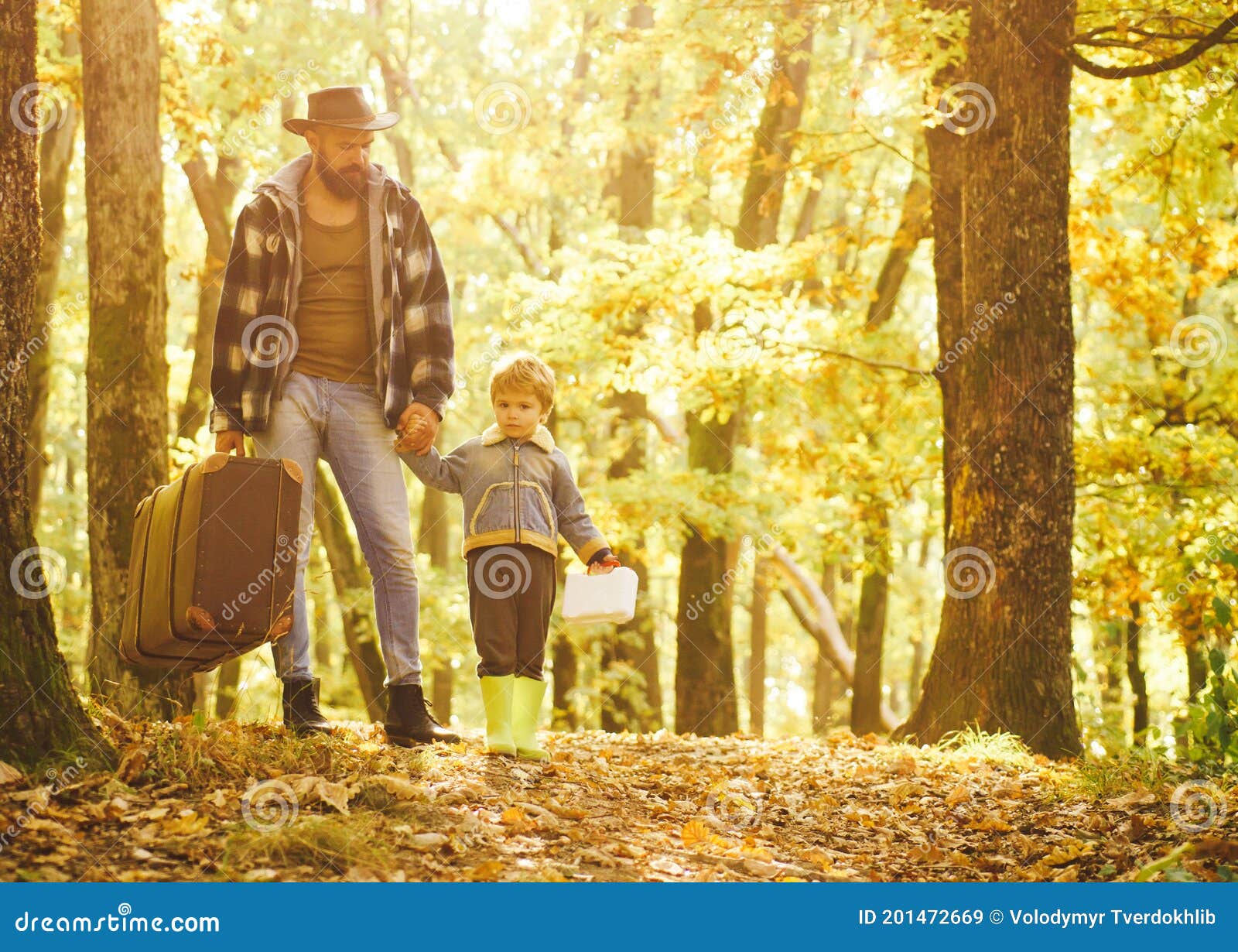 Father And Son Playing In The Autumn Forest Father And Son Walking