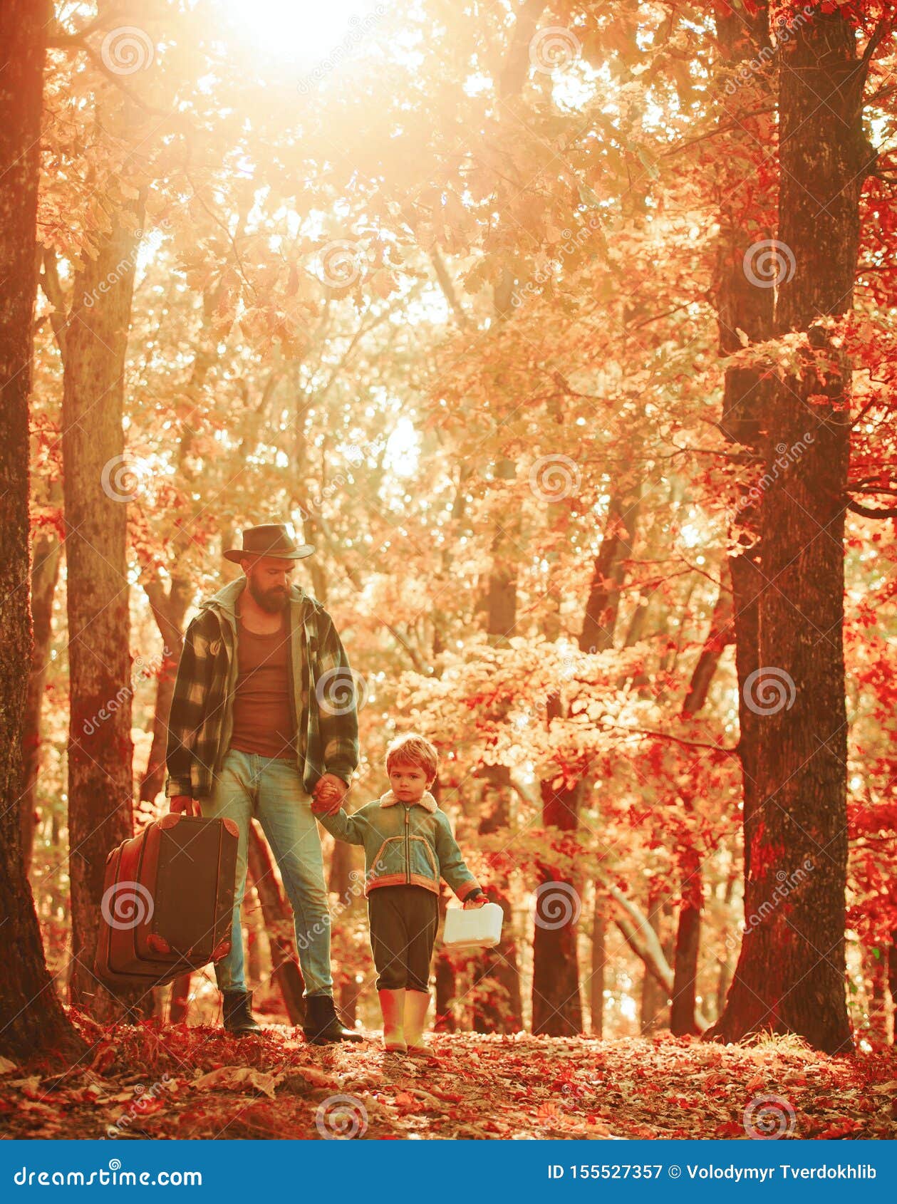 Father And Son Playing In The Autumn Forest Father And Son Walking