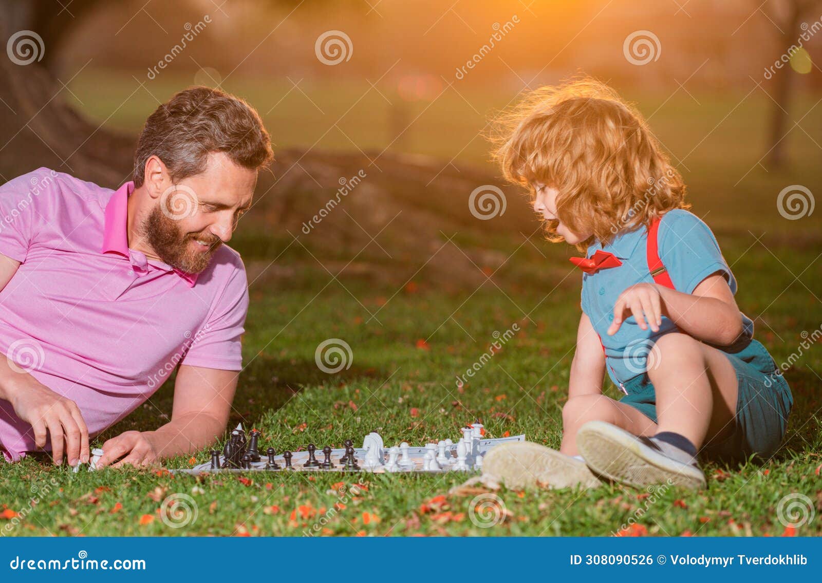 Father and Son Playing Chess Spending Time Together in Park. Active ...