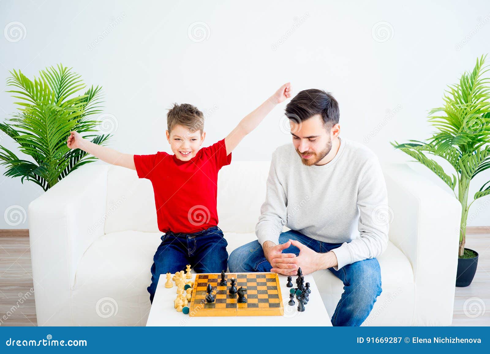 Father and Son Playing Chess Stock Image - Image of home, chess: 91669287