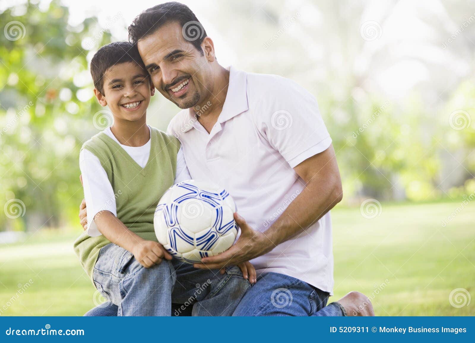 Father and Son Playing Football Stock Image - Image of camera, holding ...