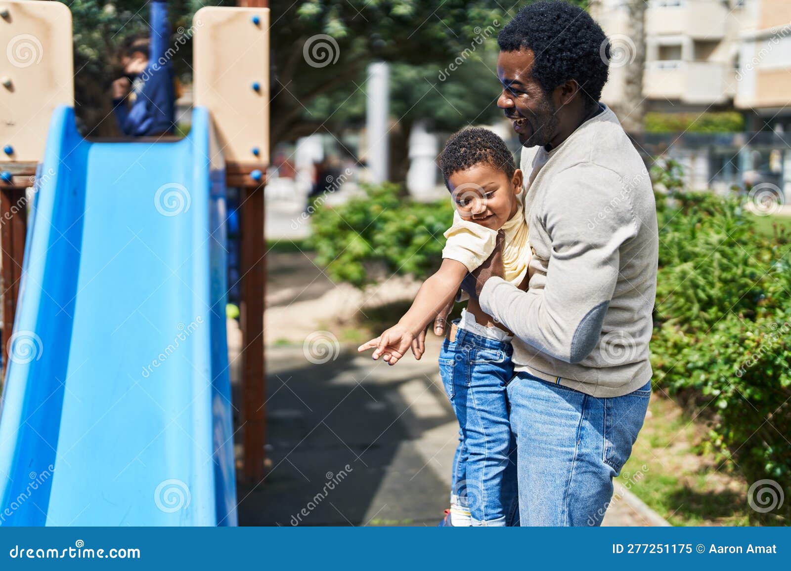 Father and Son Playing on Slide at Playground Stock Image - Image of ...
