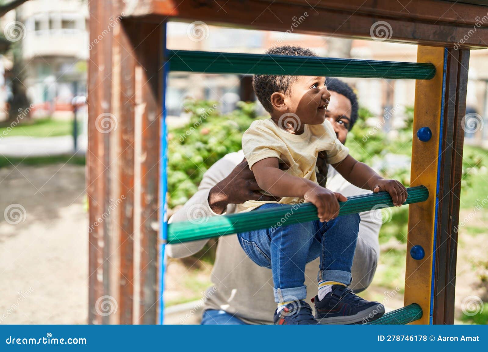 Father and Son Playing on Slide at Playground Stock Photo - Image of ...