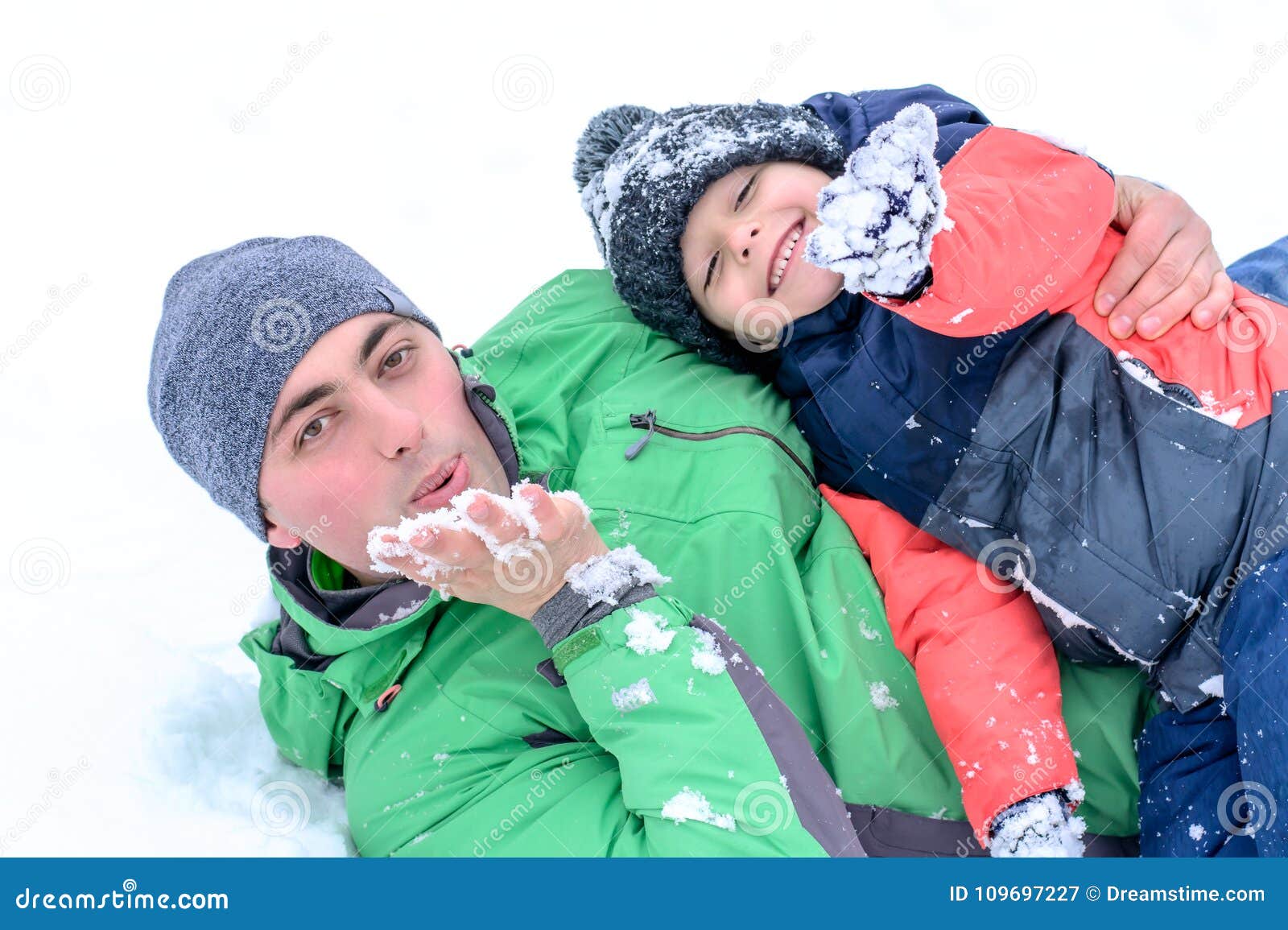 Father and Son Playing in the Snow Stock Image - Image of male, father ...