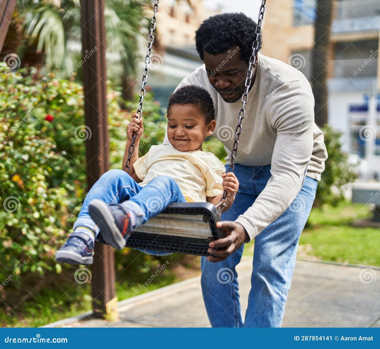 Father and Son Playing on Swing at Playground Stock Image - Image of childhood, american: 287854141