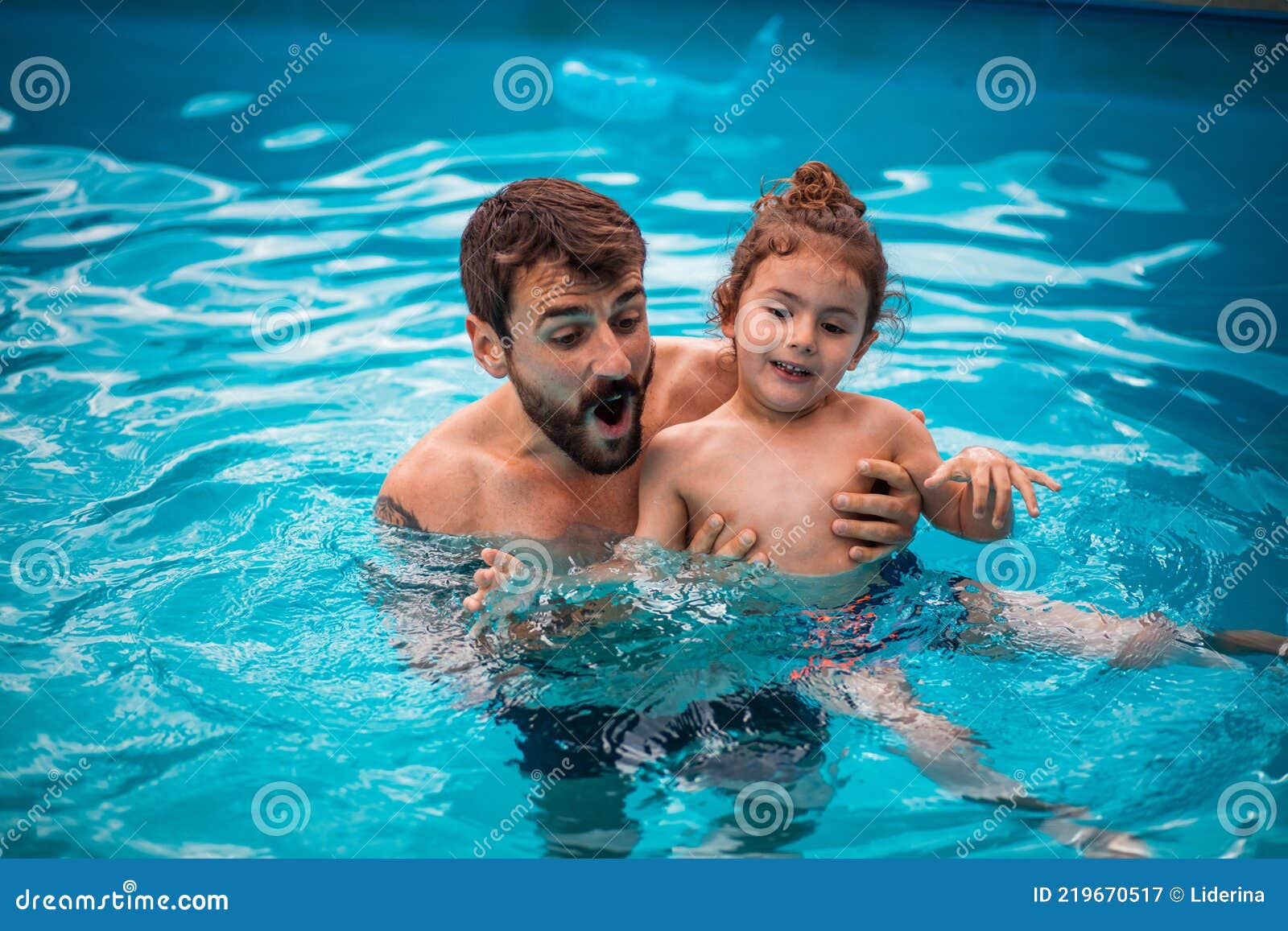 Father and Son Playing Together in the Swimming Pool Stock Image ...