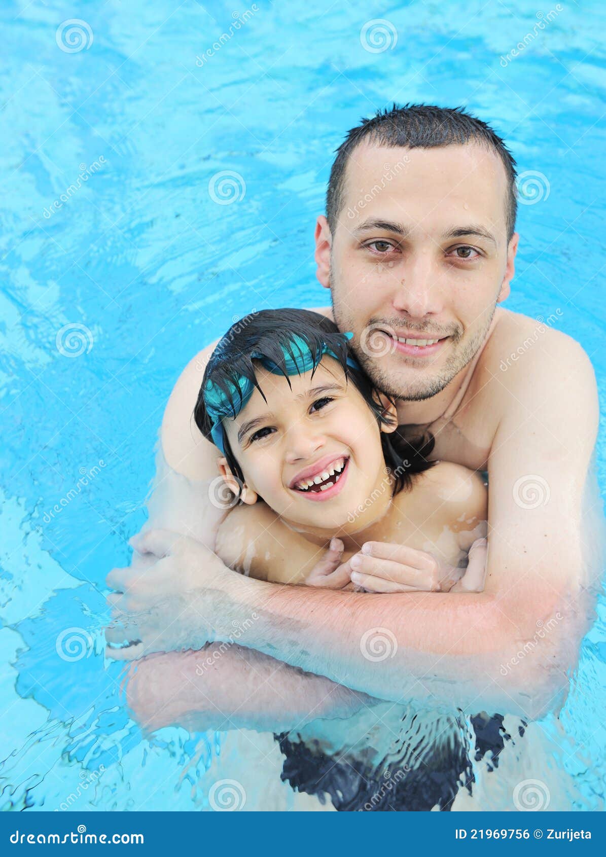 Father and son in pool stock photo. Image of cheerful - 21969756