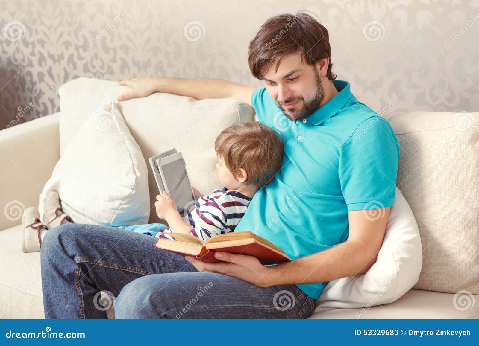 Father and Son Read a Book or Tablet Stock Photo - Image of smile ...