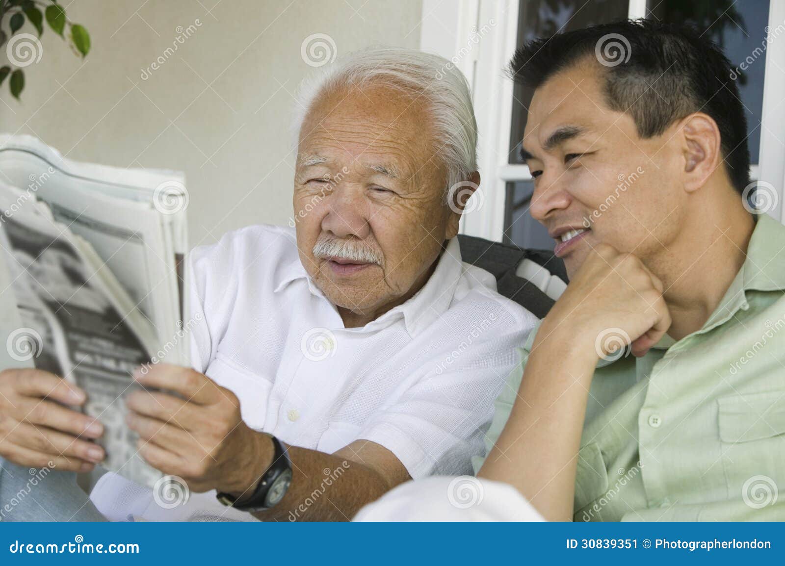Father Son Reading Newspaper Outdoors Stock Photos - Free & Royalty ...