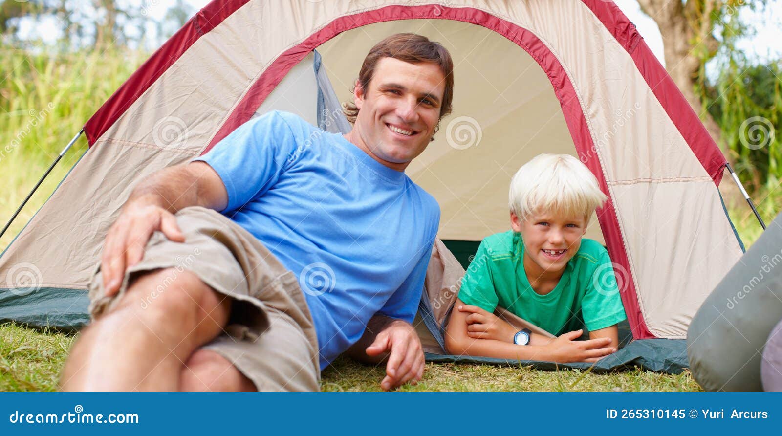 Father and Son Resting in Tent. Portrait of Father and Son Resting in ...