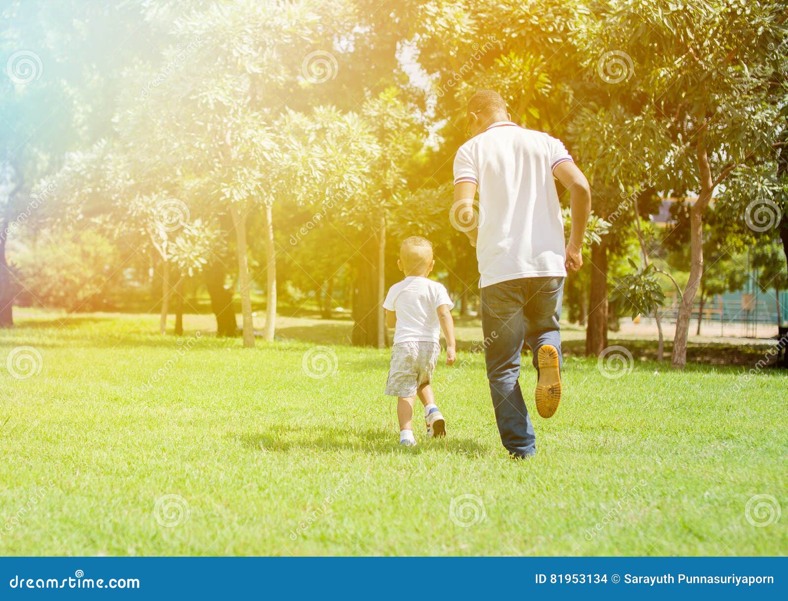 Father and Son Running and Chasing Each Other in Green Park Stock Photo ...