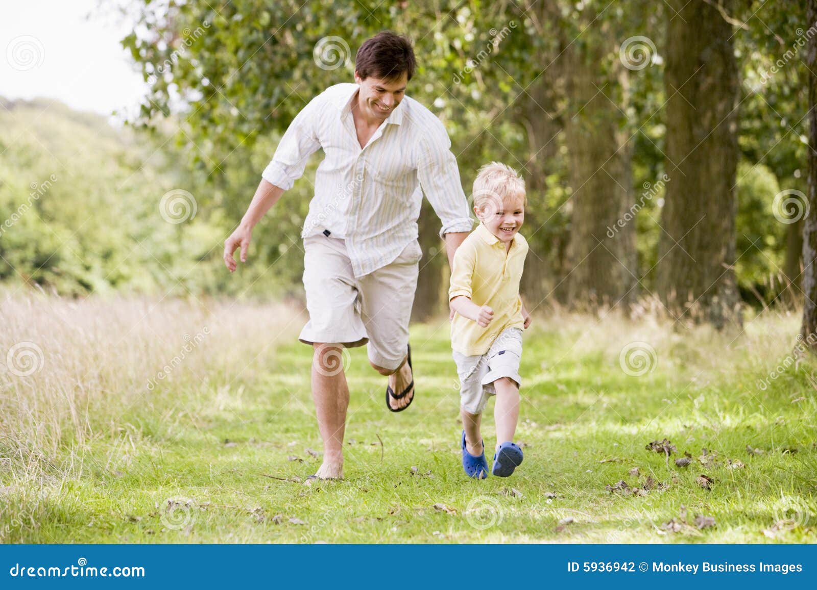 Father and Son Running on Path Smiling Stock Photo - Image of laughing ...