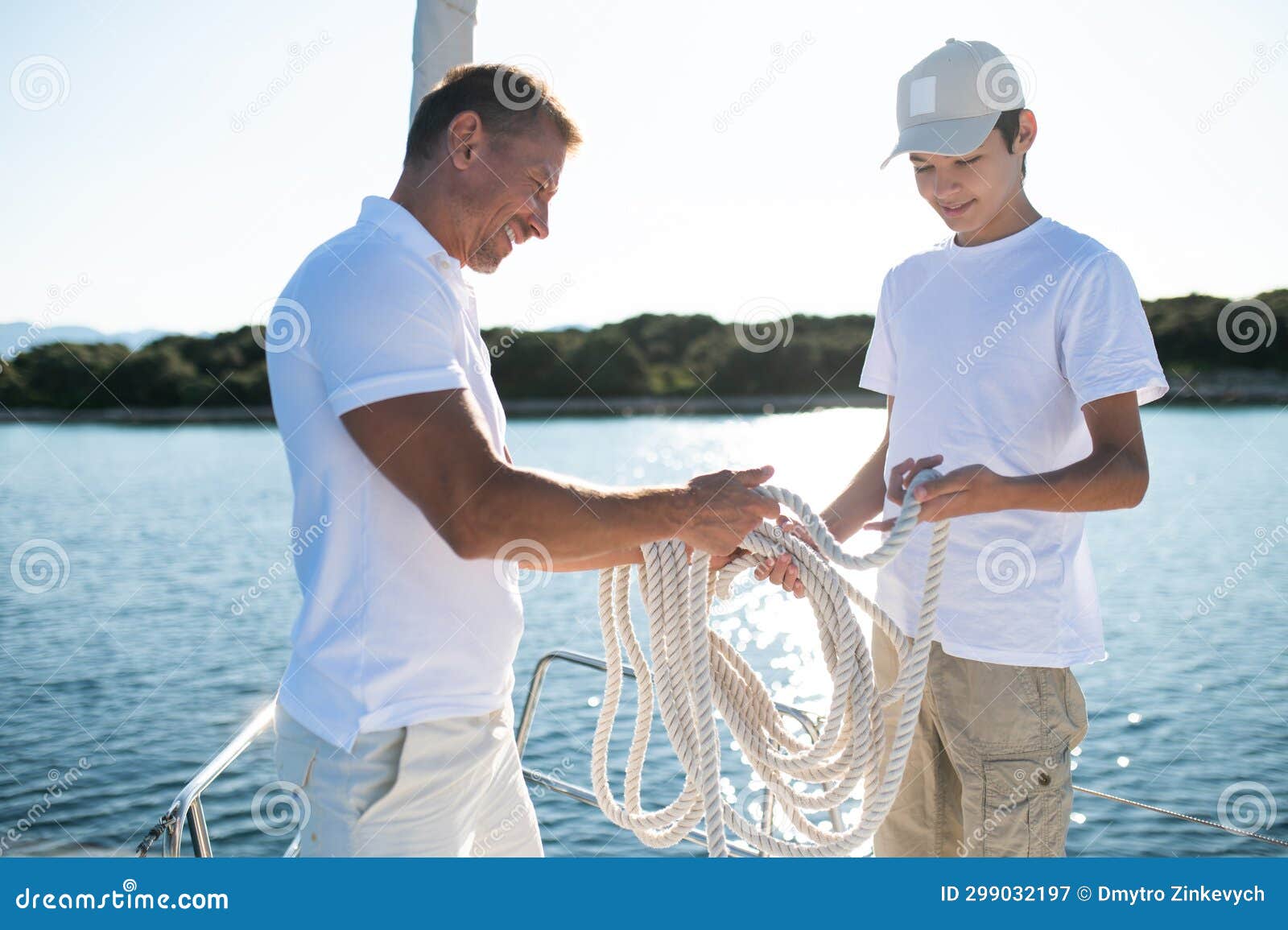 Father and Son Sailing on the Yacht on a Sunny Day Stock Image - Image ...