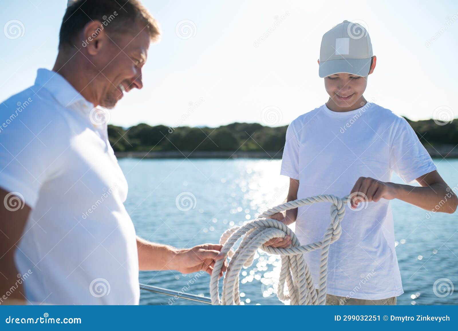 Father and Son Sailing on the Yacht on a Sunny Day Stock Image - Image ...