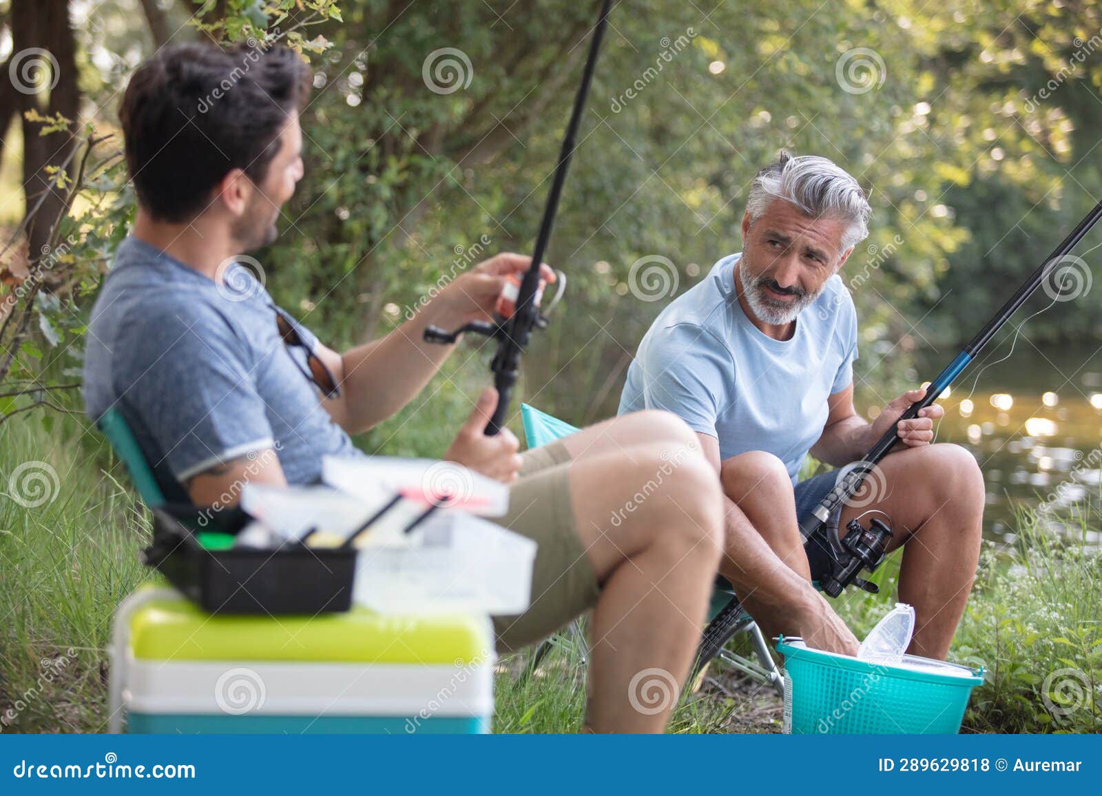 Father and son sat fishing stock photo. Image of park - 289629818