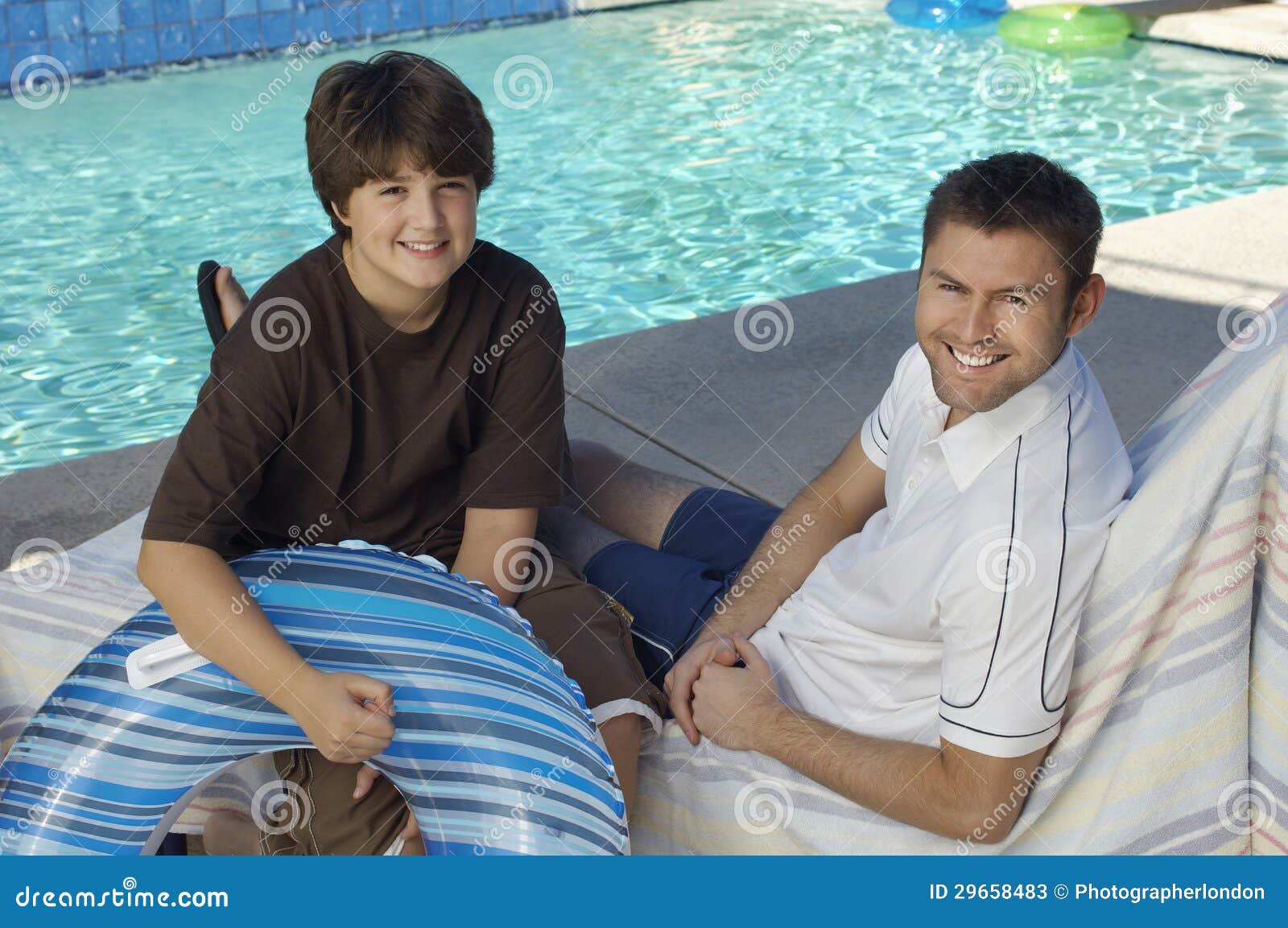 Father and Son Sitting Together on Deckchair Stock Image - Image of ...