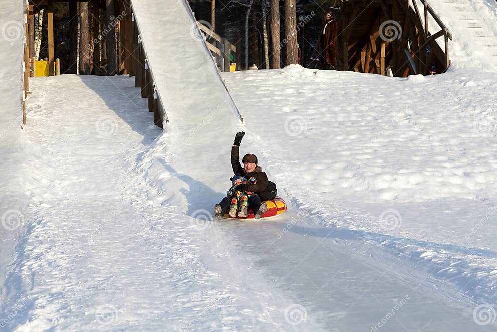 Father with son on a sled stock image. Image of parent - 28892909