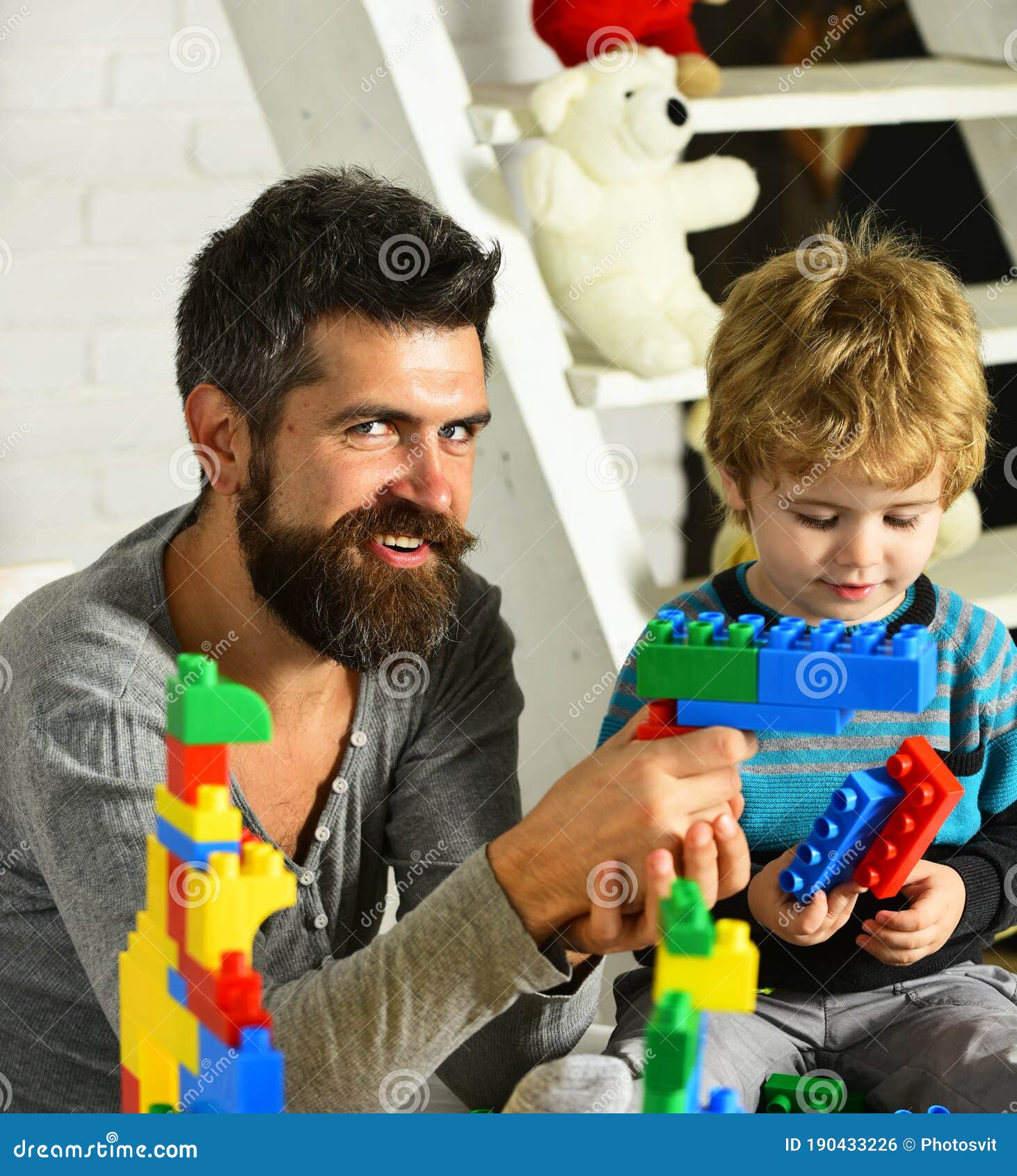 Father and Son with Smiling Faces Create Constructions Stock Photo ...