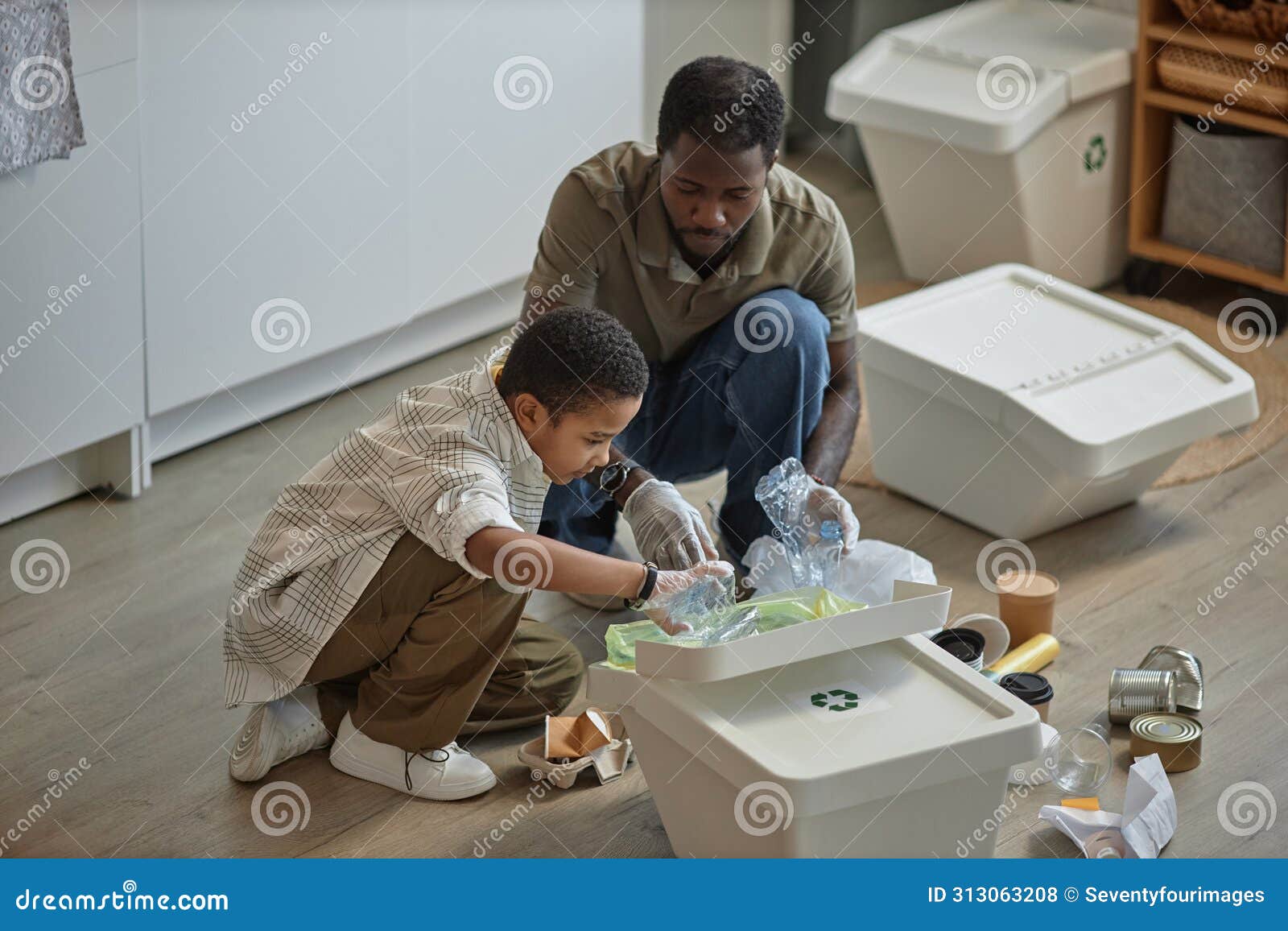 Father and Son Sorting Home Waste Together Stock Photo - Image of help ...