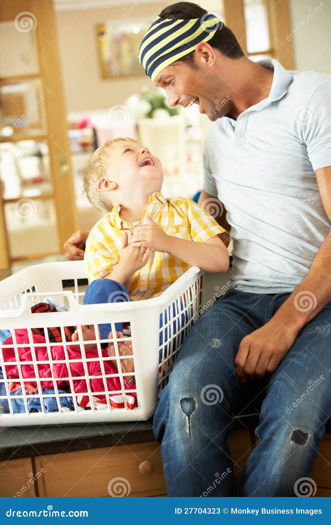 Father and Son Sorting Laundry Stock Image - Image of humour, adult ...