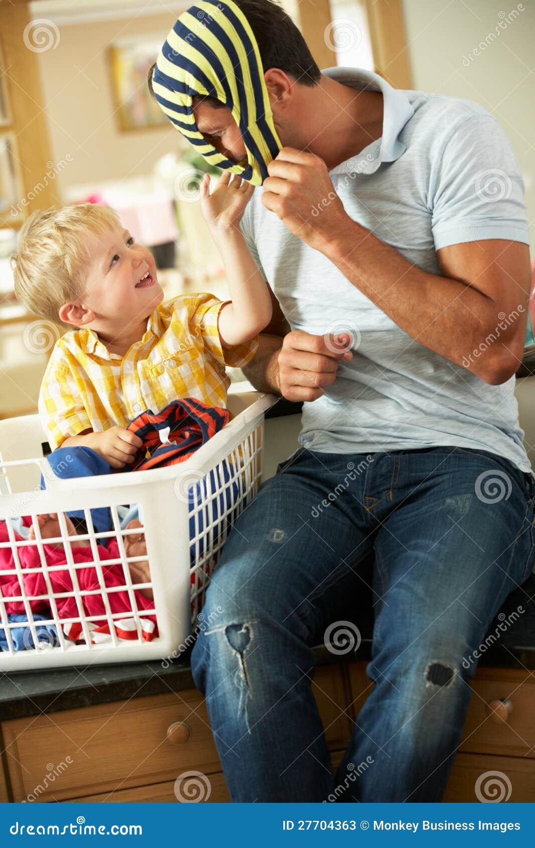 Father and Son Sorting Laundry Stock Image - Image of male, pants: 27704363