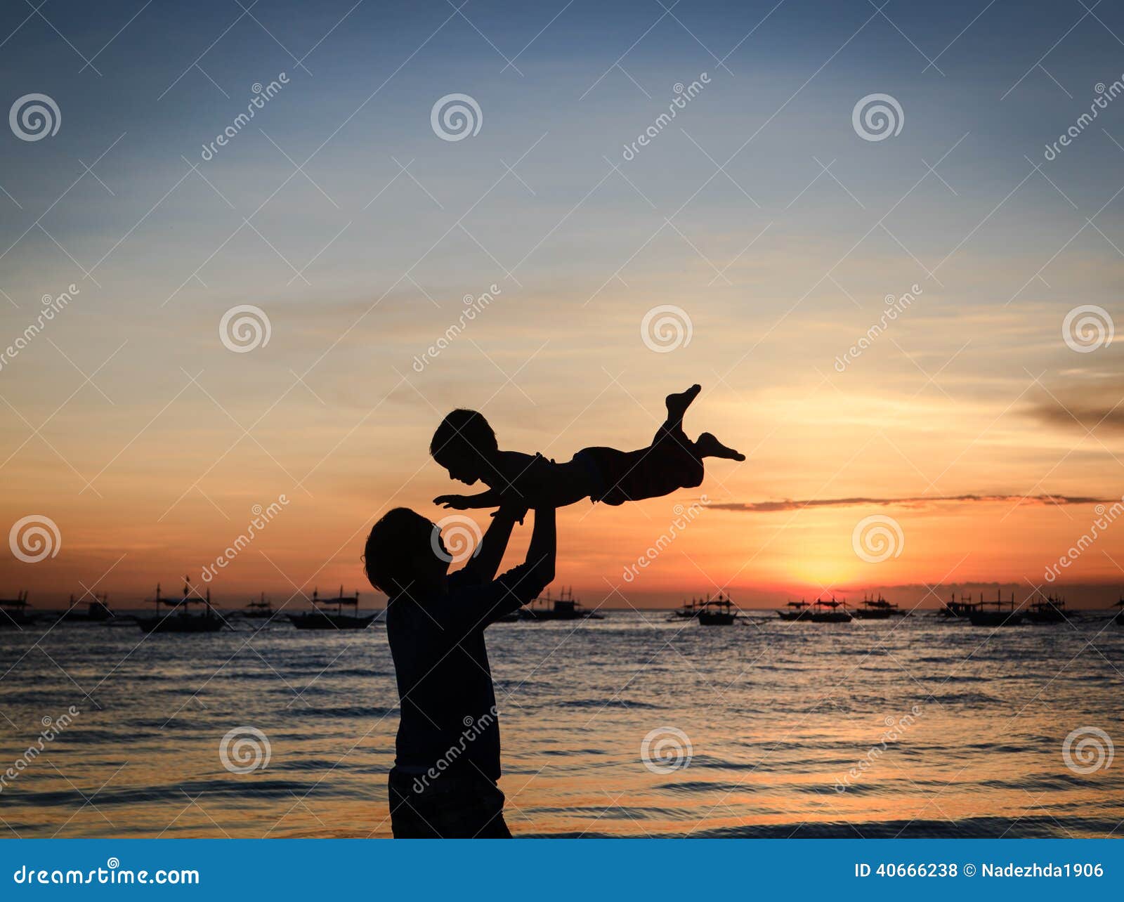 Father and Son at Sunset Sea Stock Photo - Image of moment, enjoyment ...