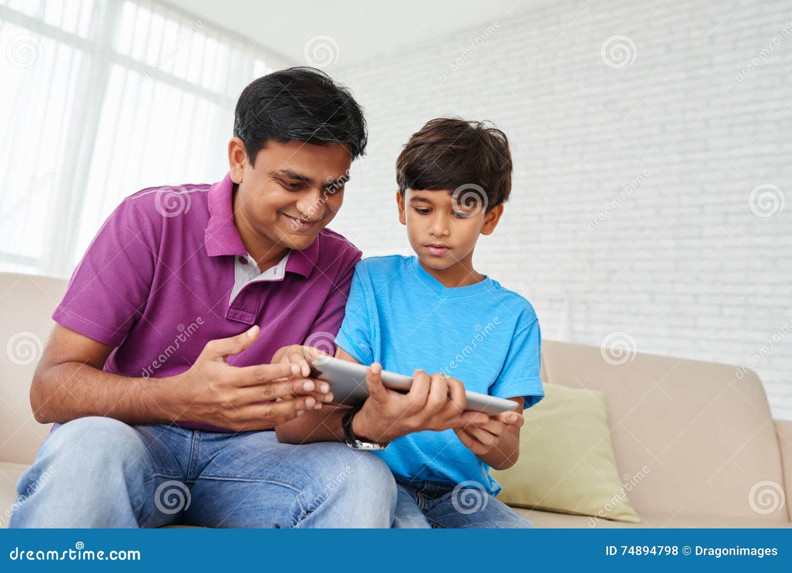 Father, son and tablet stock photo. Image of education - 74894798