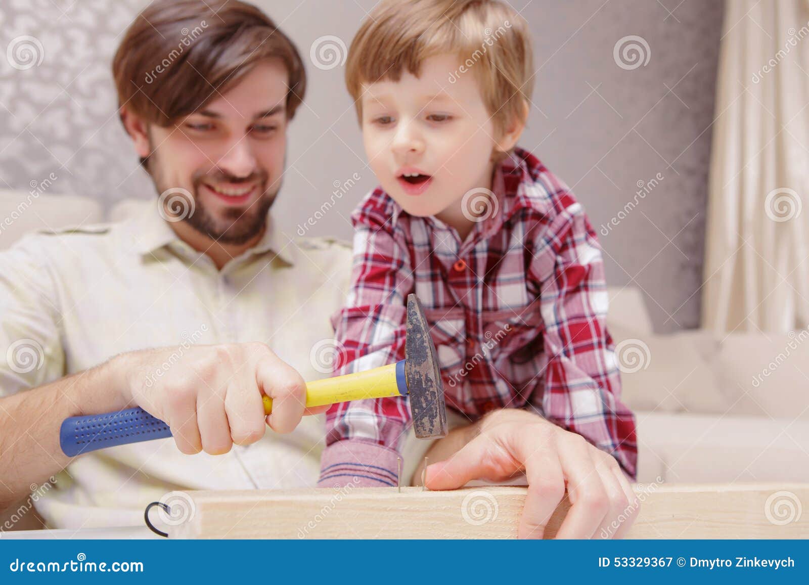 Father and son use hammer stock image. Image of game - 53329367
