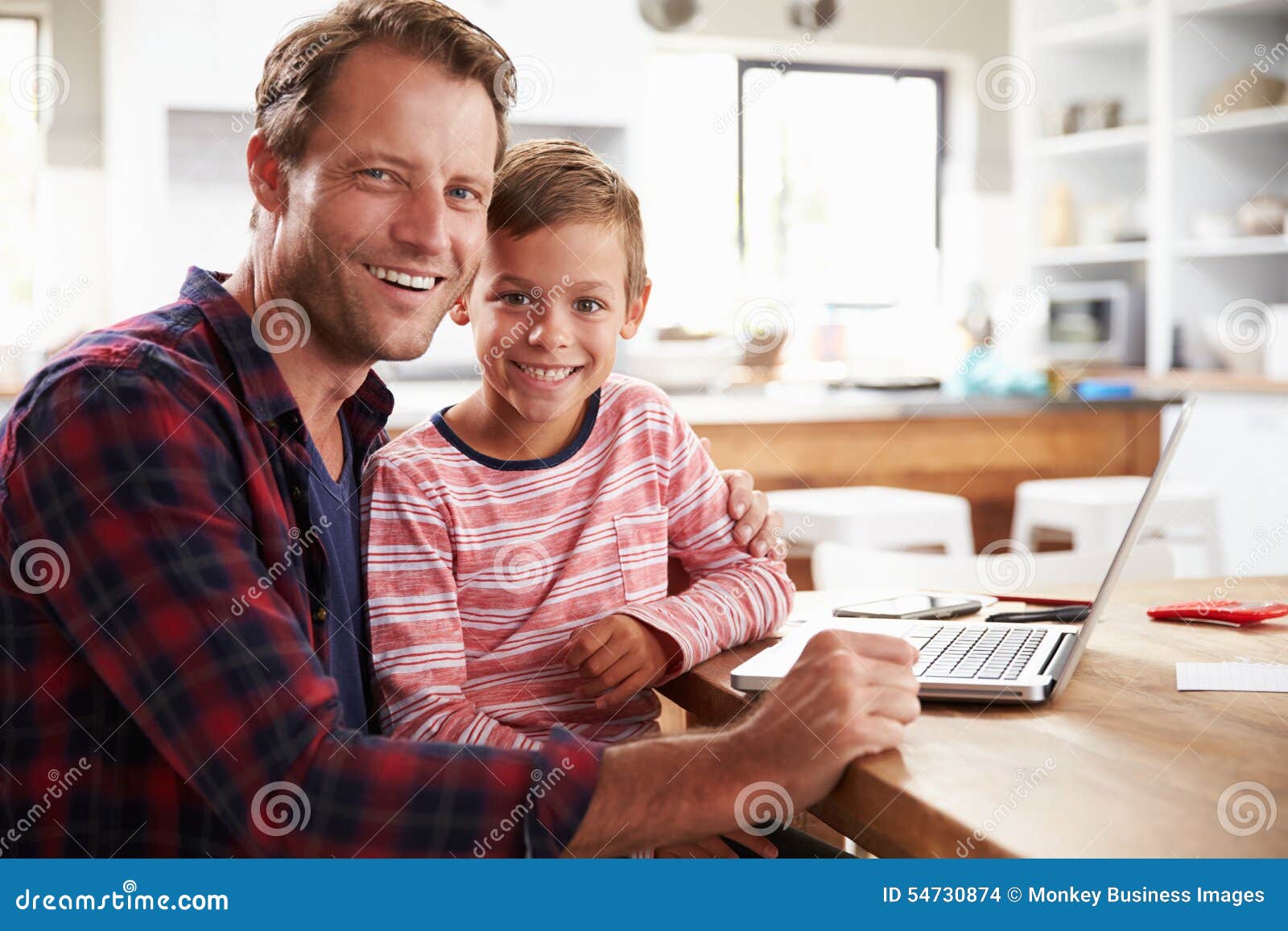 Father and Son Using Laptop Computer at Home Stock Photo - Image of ...