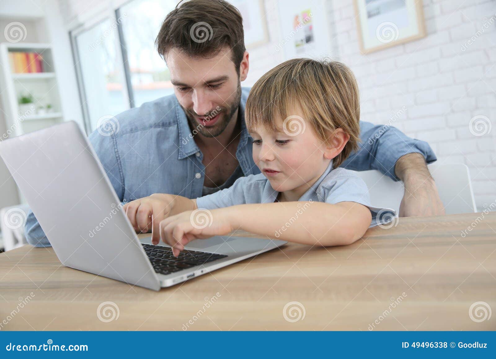 Father and Son Using a Laptop Together Stock Photo - Image of control ...