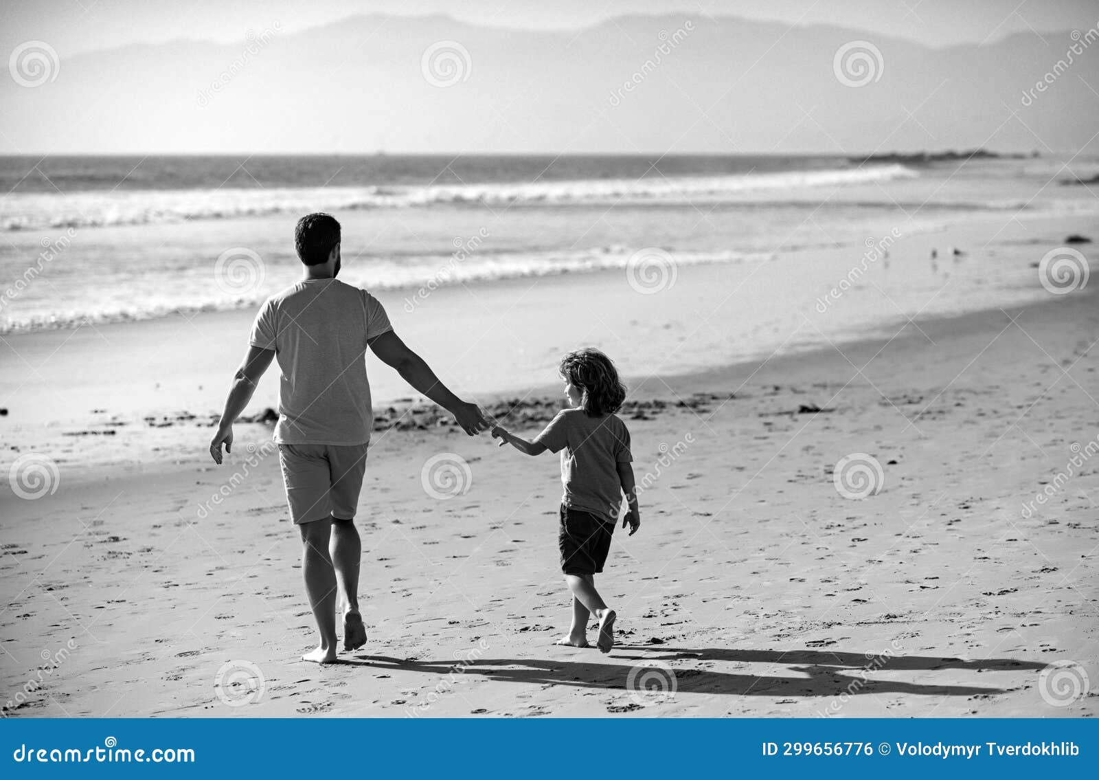 Father and Son Walking on Sea. Dad and Child Having Fun Outdoors. Stock ...