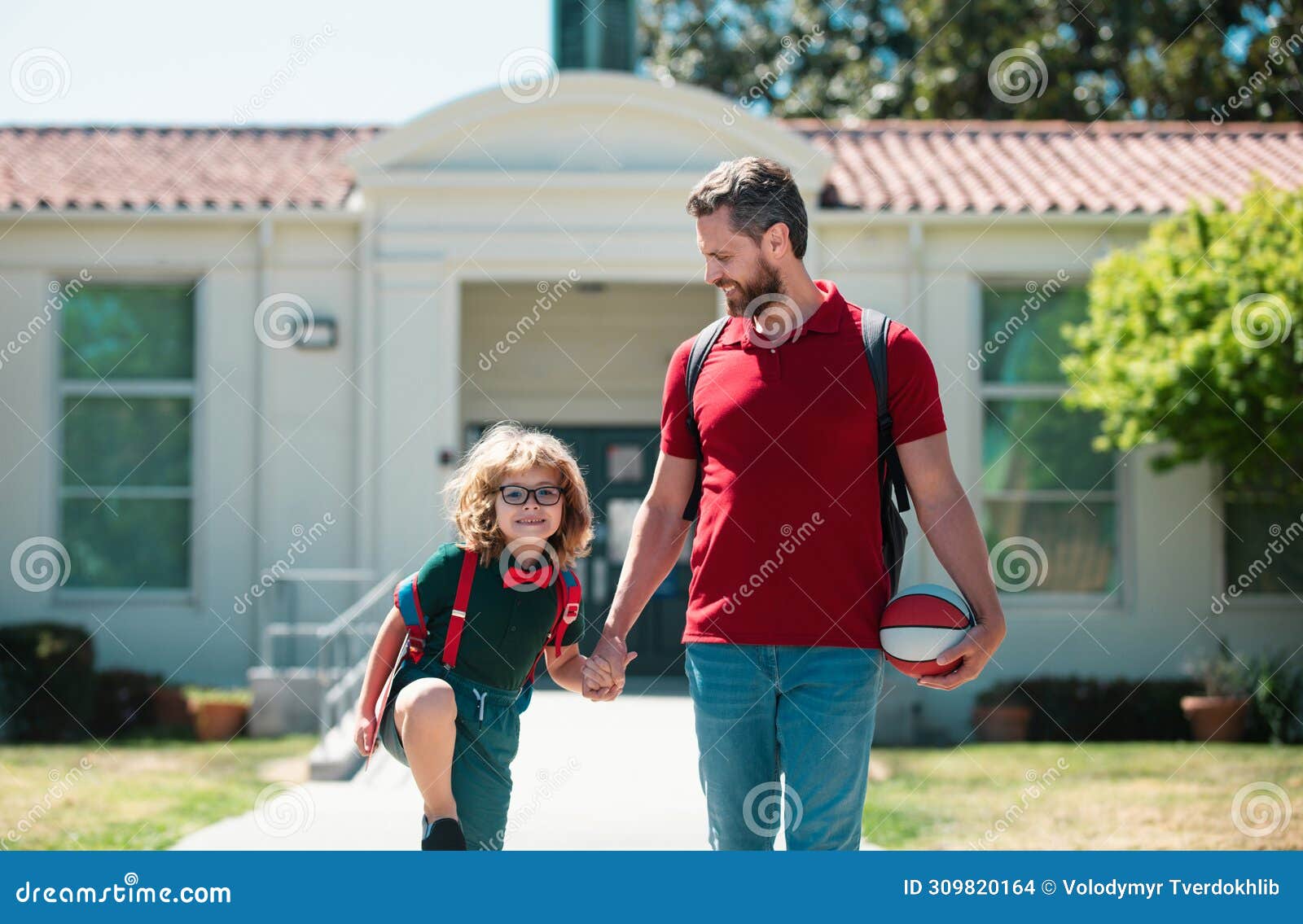 Father and Son Walking Trough School Park. Beginning of Lessons. Stock ...