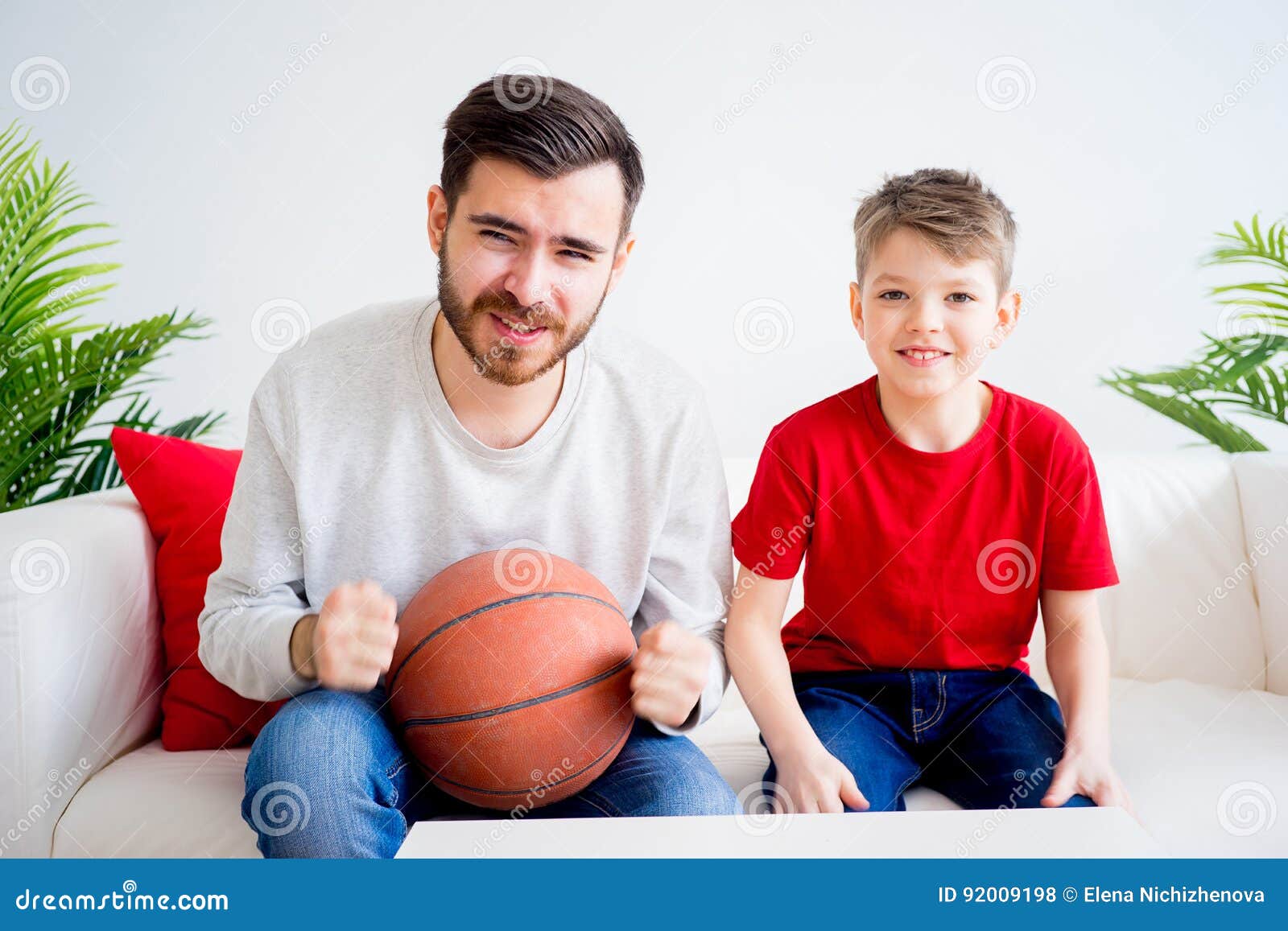 Father and Son Watching Basketball Stock Photo - Image of rest, casual ...