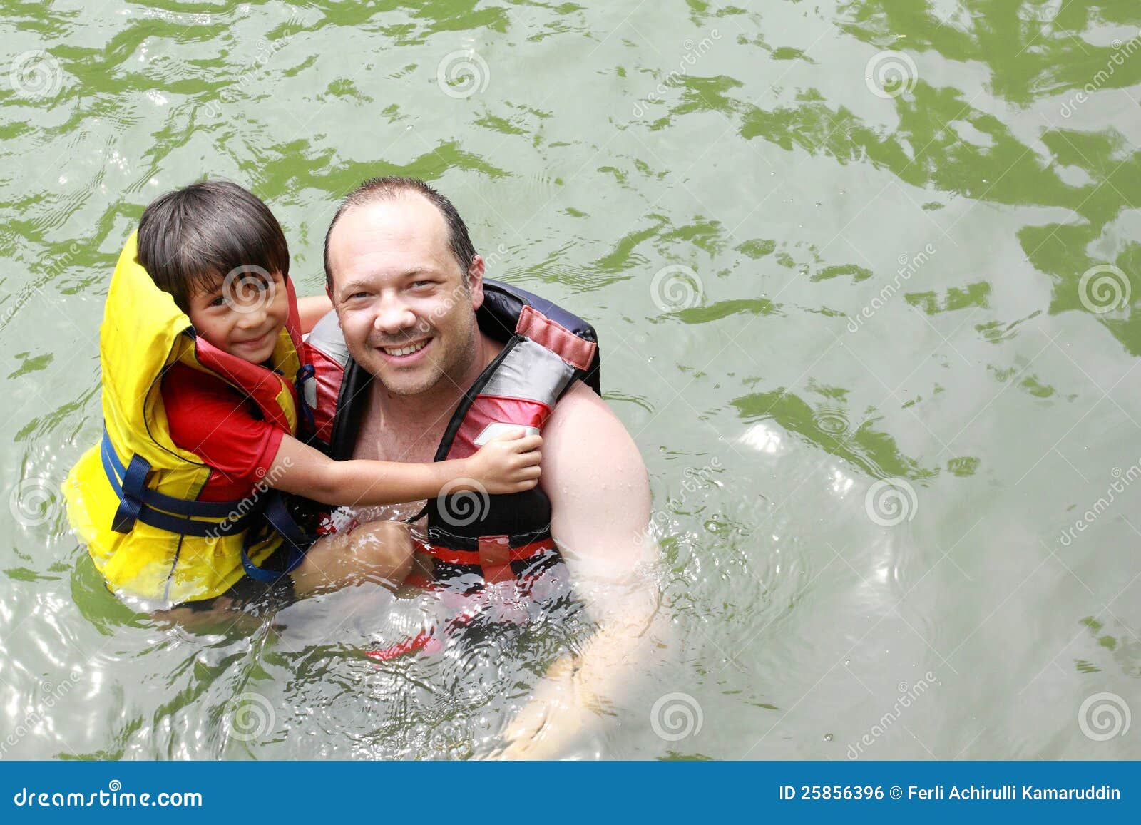 Father and Son in the Water Stock Photo - Image of float, cute: 25856396