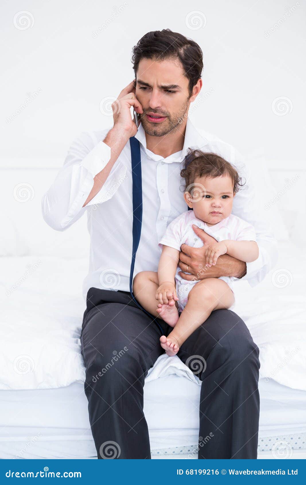 Father Talking on Mobile Phone with Baby Stock Photo - Image of ...