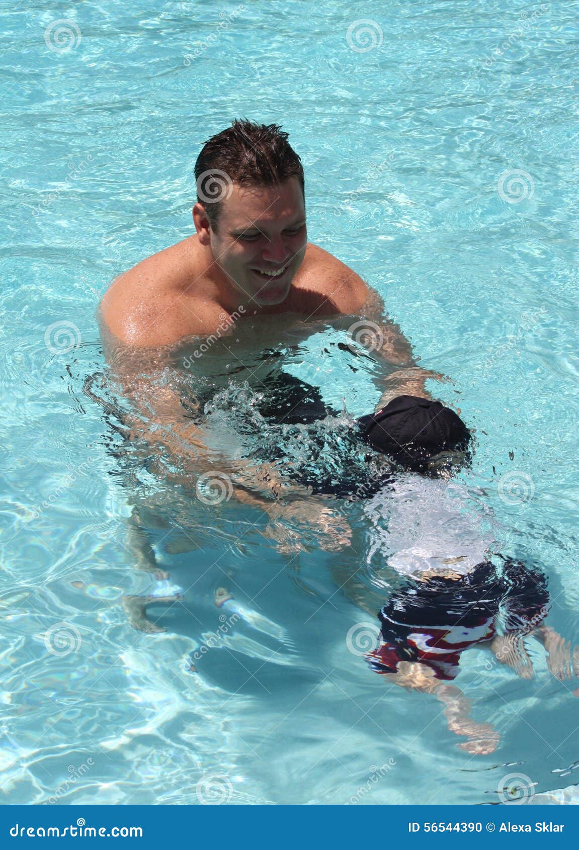 Father teach son to swim stock photo. Image of happy - 56544390