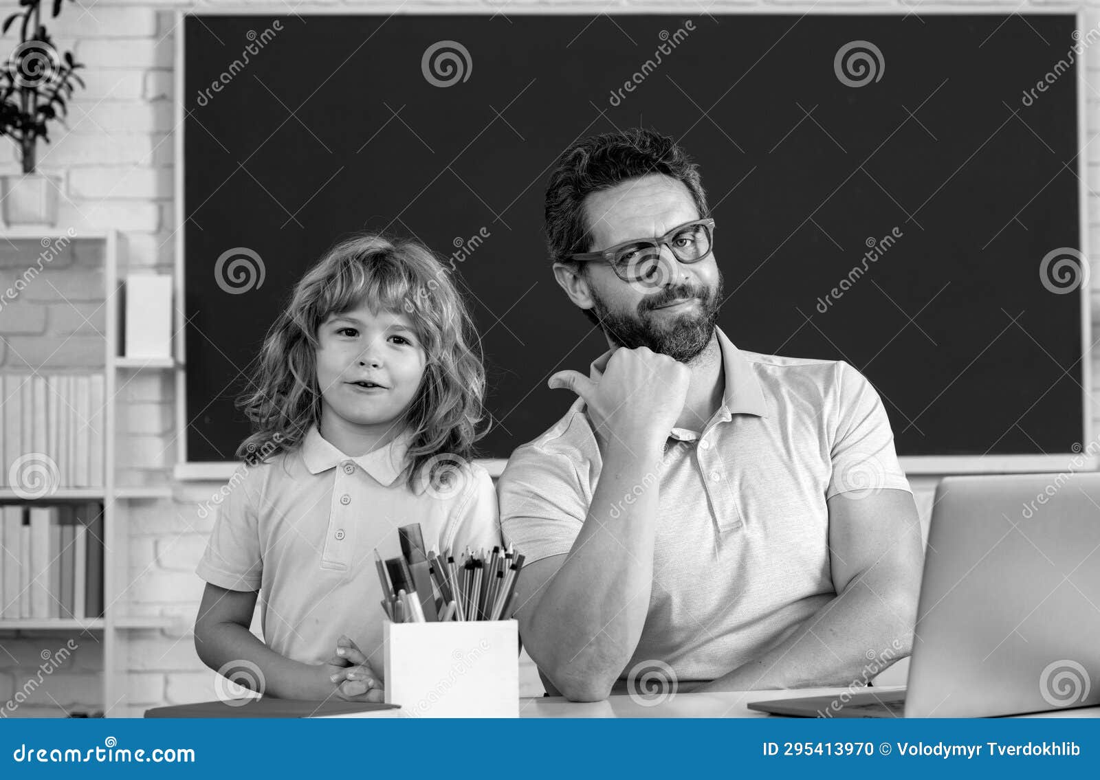 Father Teacher Helping a Son Boy in School Lessons. Education and ...