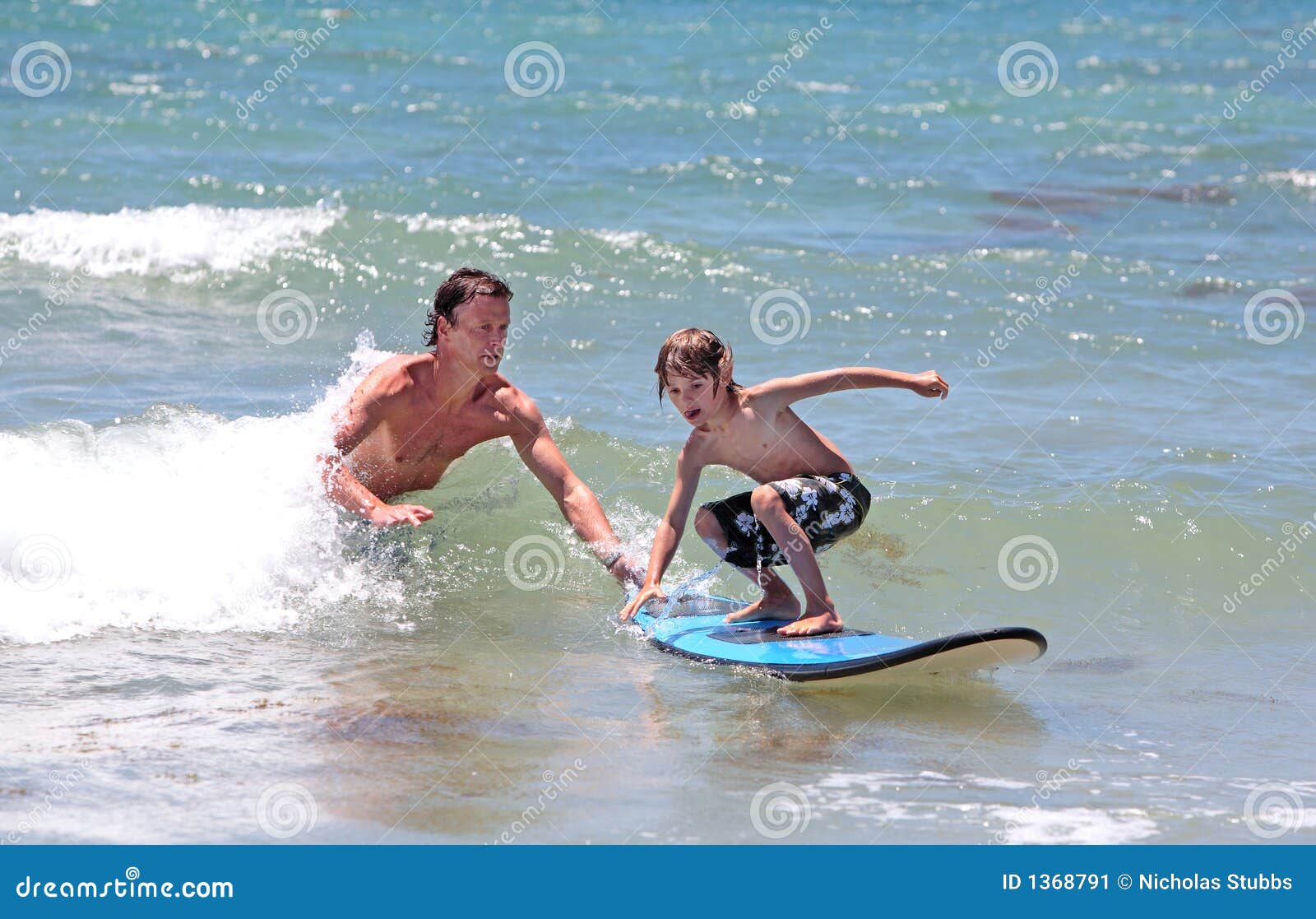 Father Teaching His Young Son To Surf Stock Image - Image of active ...