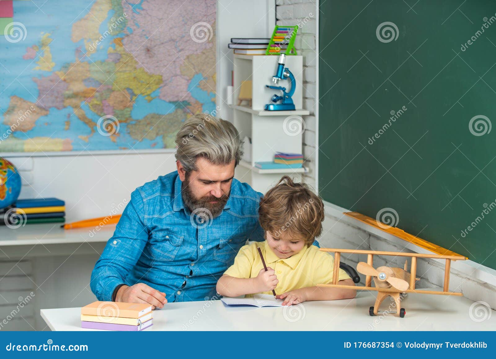 Father Teaching Son. Learning Concept. Pupil Learning Letters and ...