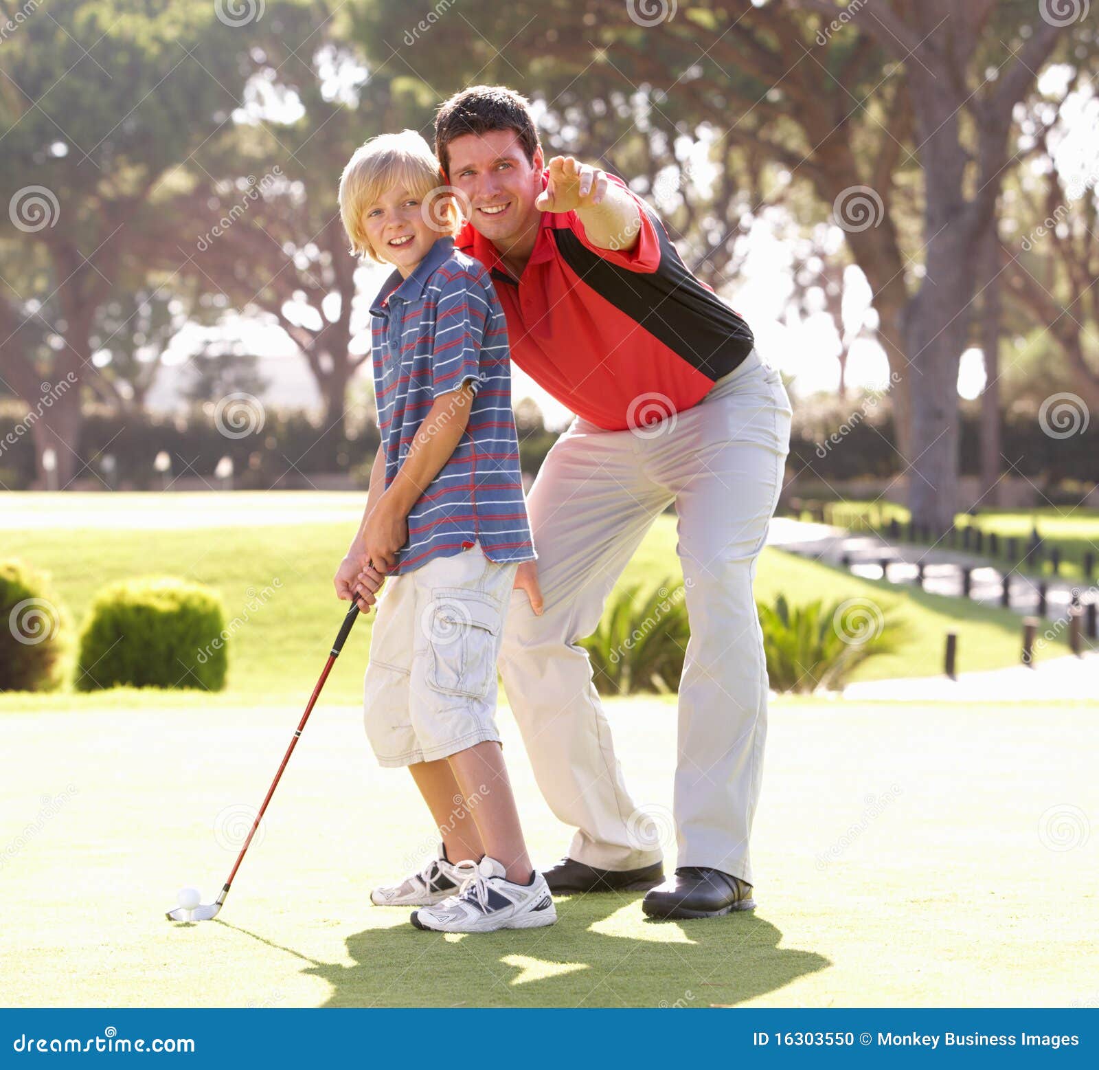 Father Teaching Son To Play Golf Stock Photo - Image of club, green ...
