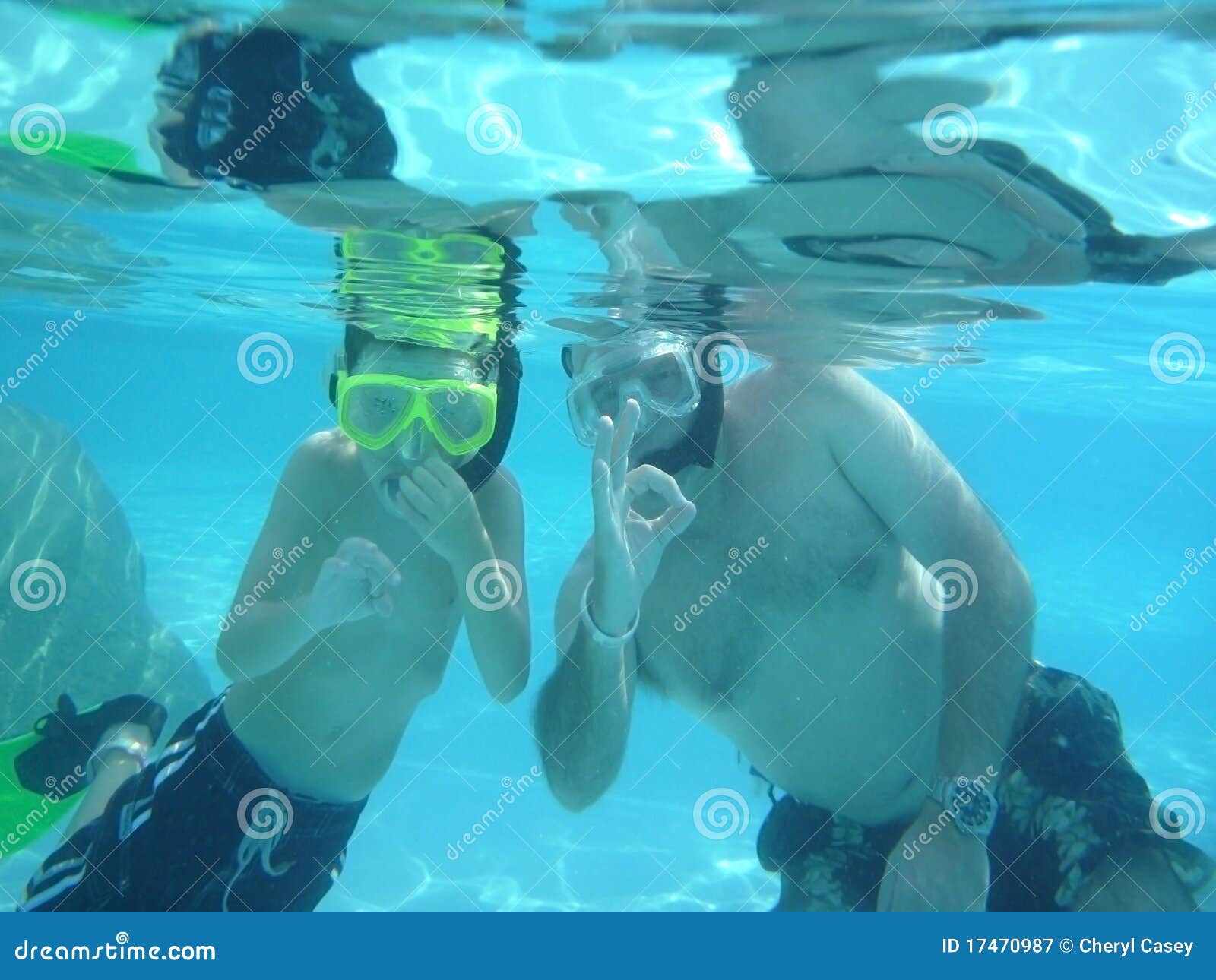 Father Teaching Son Underwater Sign Language Stock Image - Image of ...