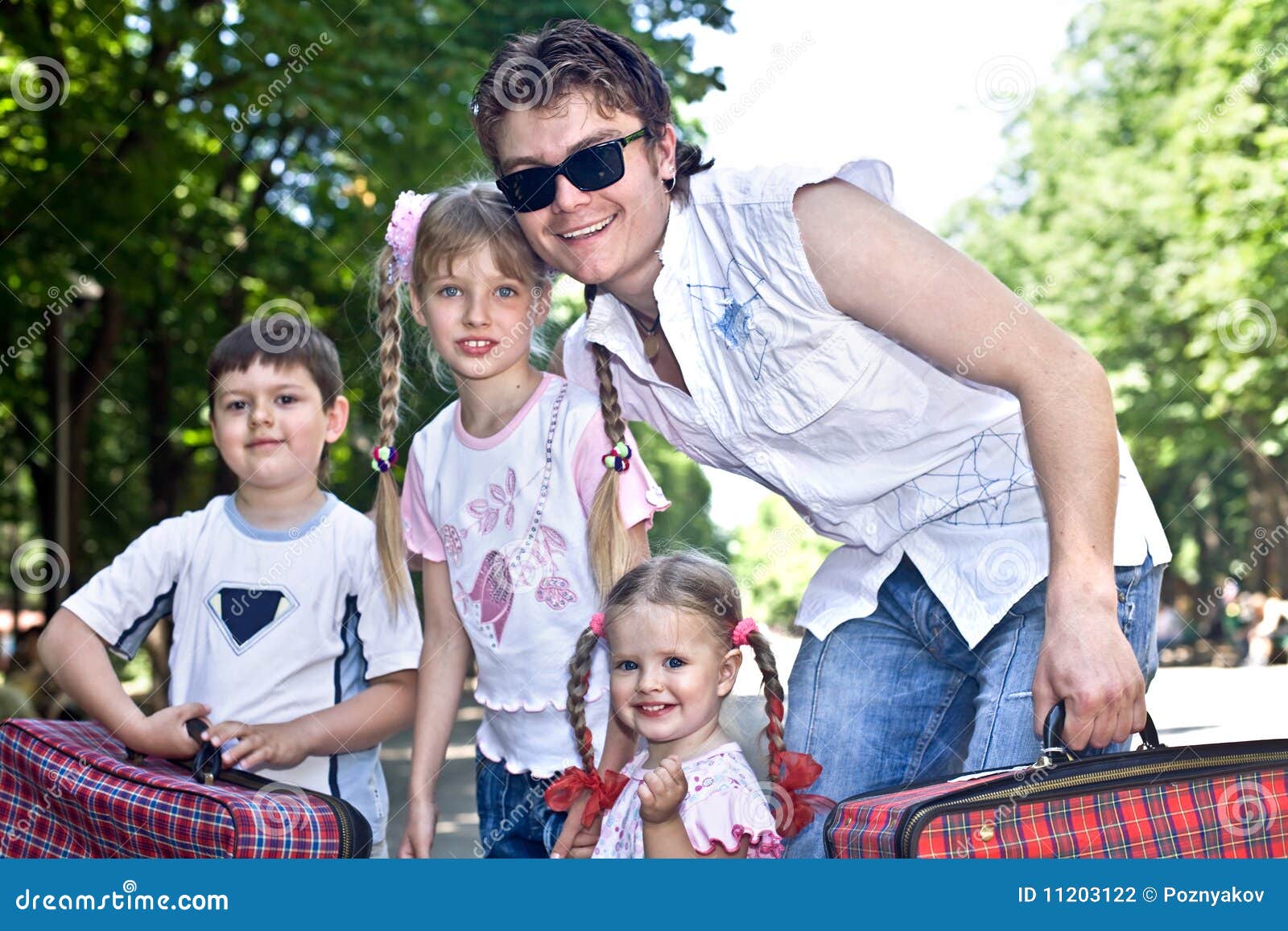 Father and Three Children in Park with Case. Stock Photo - Image of ...