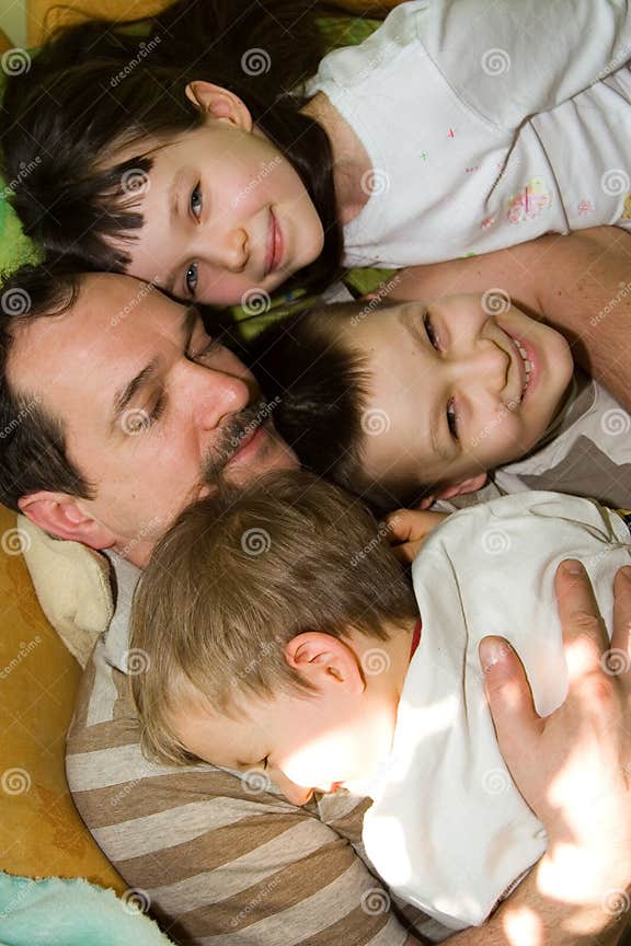 Father and Three Young Sons Stock Image - Image of loving, hugging: 2053791