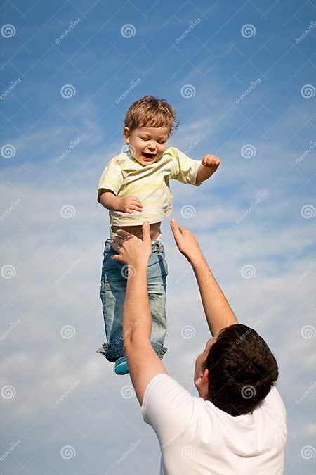 Father throwing baby boy stock photo. Image of parenthood - 28810480