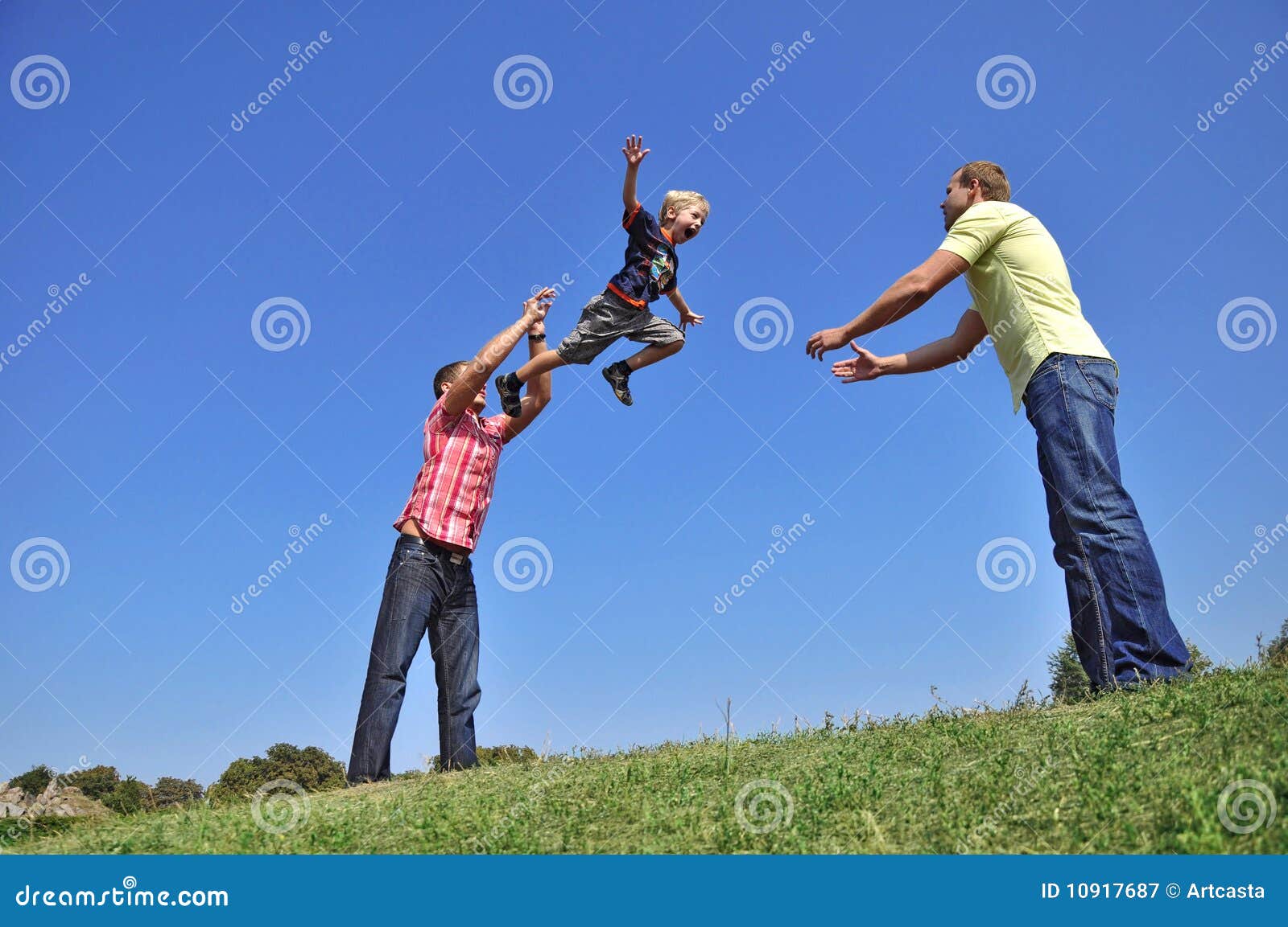 Father Throwing His Son in the Air and Catching Hi Stock Image - Image ...