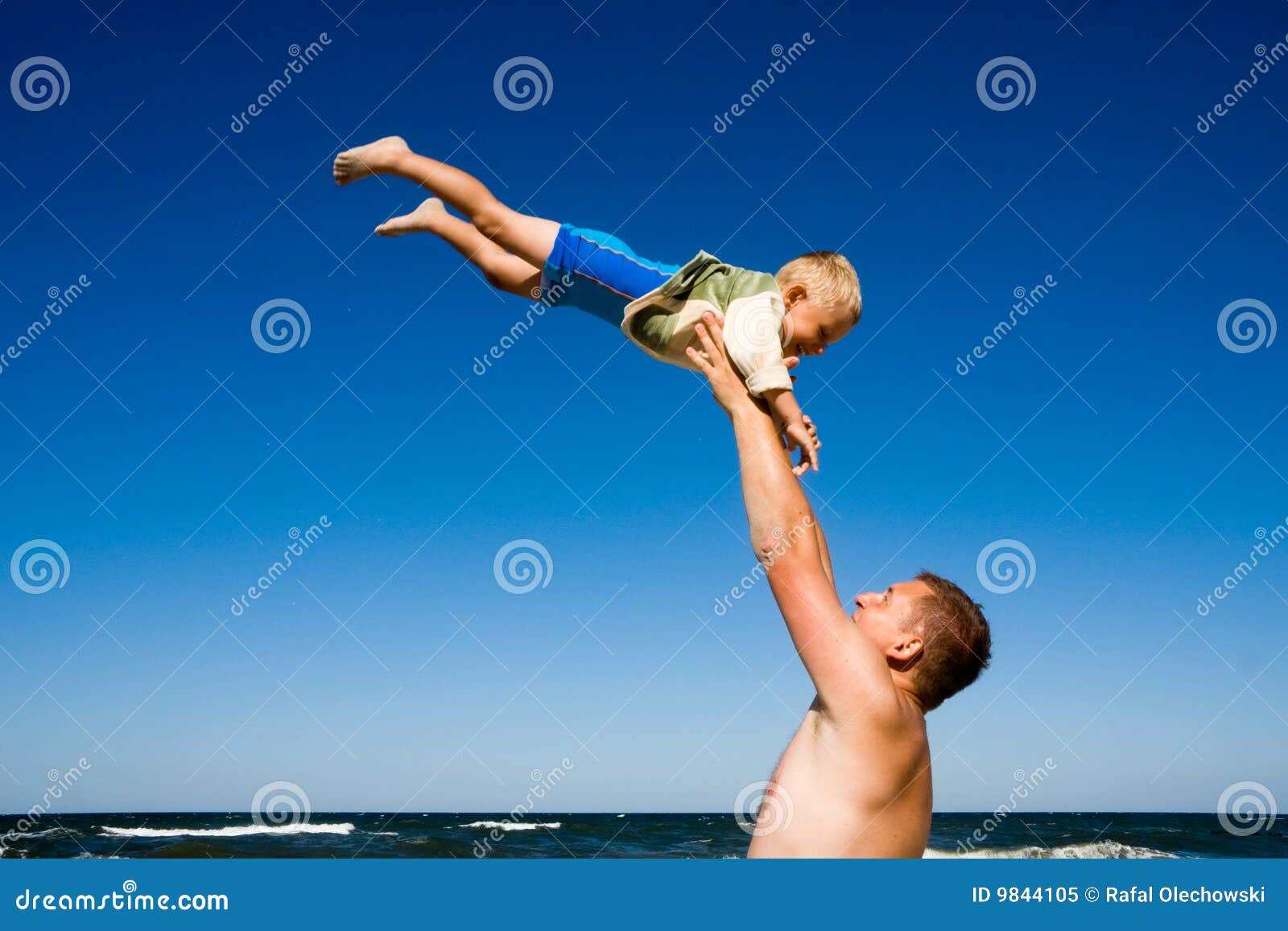 Father Throwing Son on Beach Stock Image - Image of happy, ocean: 9844105