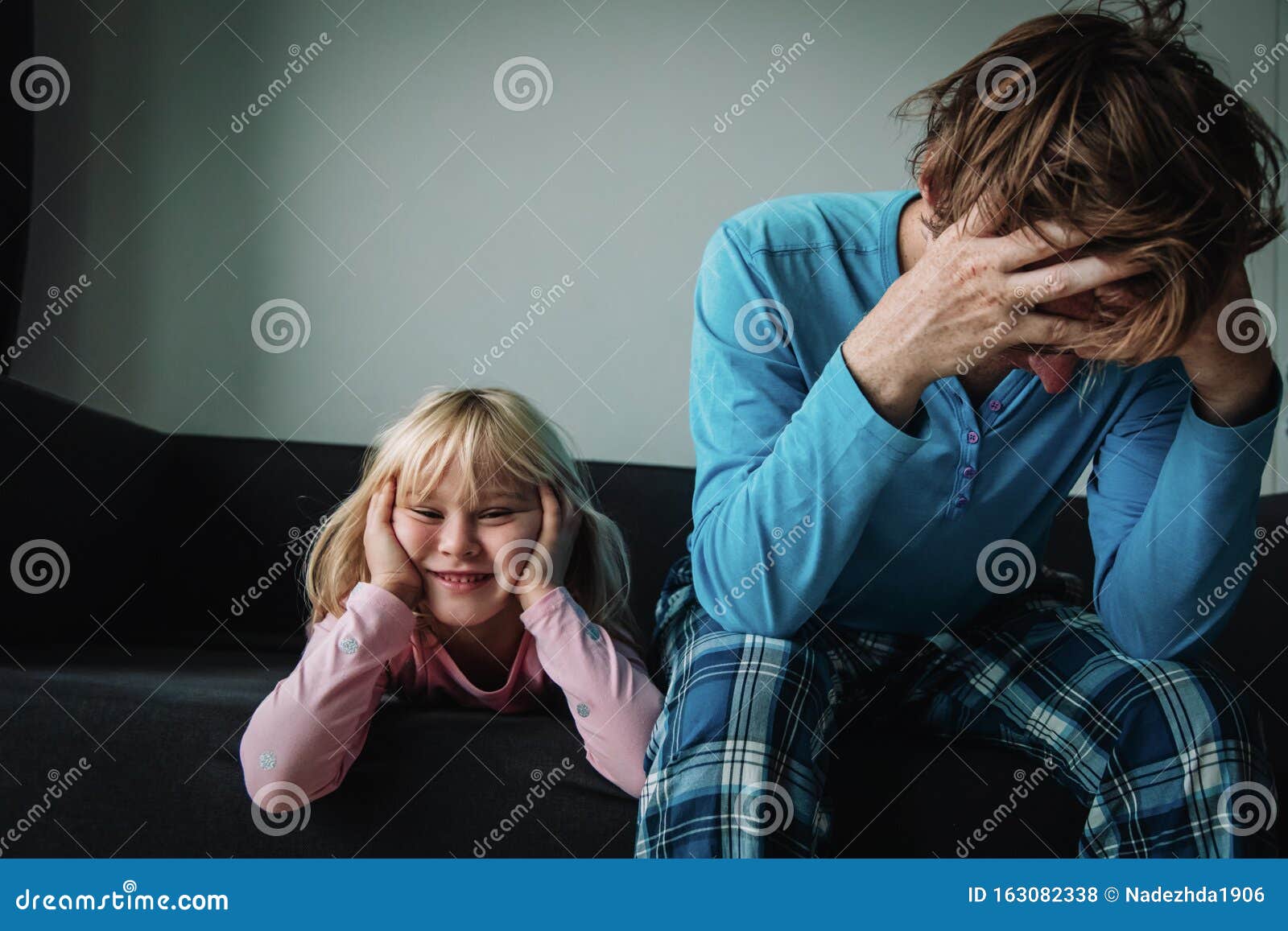 Father is Tired and Stressed while Daughter Smiles and Has Fun Stock ...