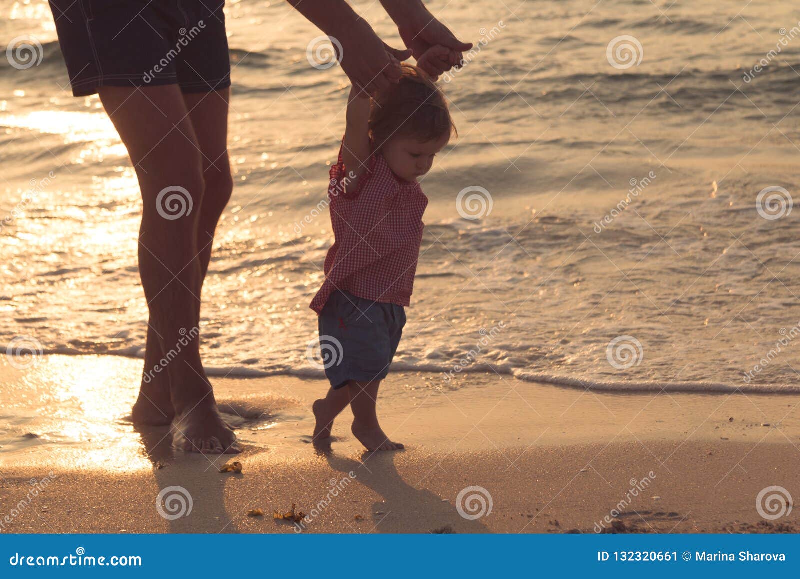Walk Within Sunset On Beach. Mirroring Of Sunsetting Horizon In Sea ...